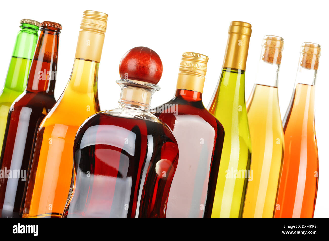 Bottles of assorted alcoholic beverages isolated on white background ...