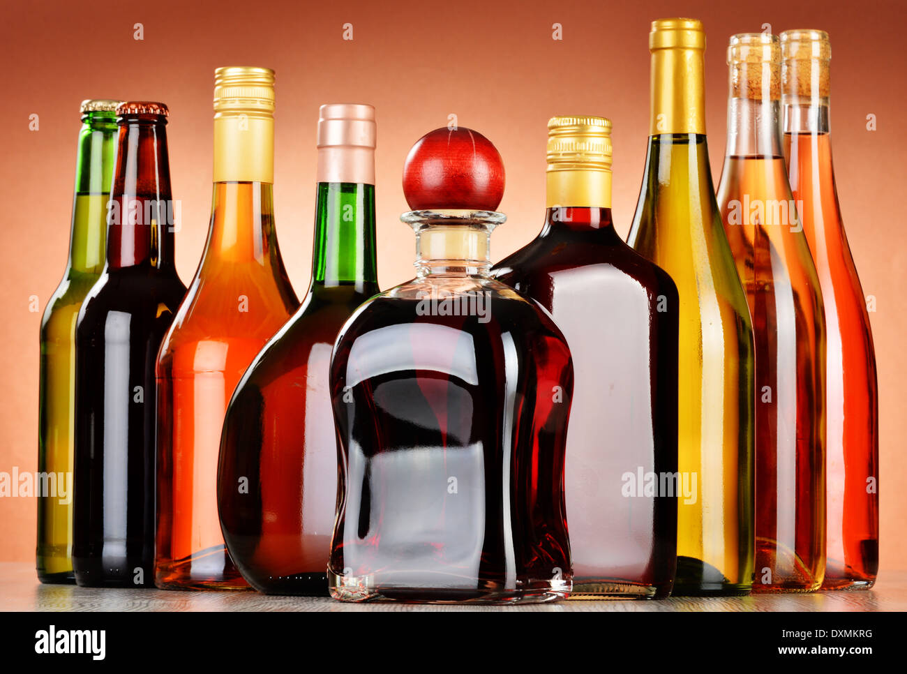 Bottles of assorted alcoholic beverages isolated on white background ...
