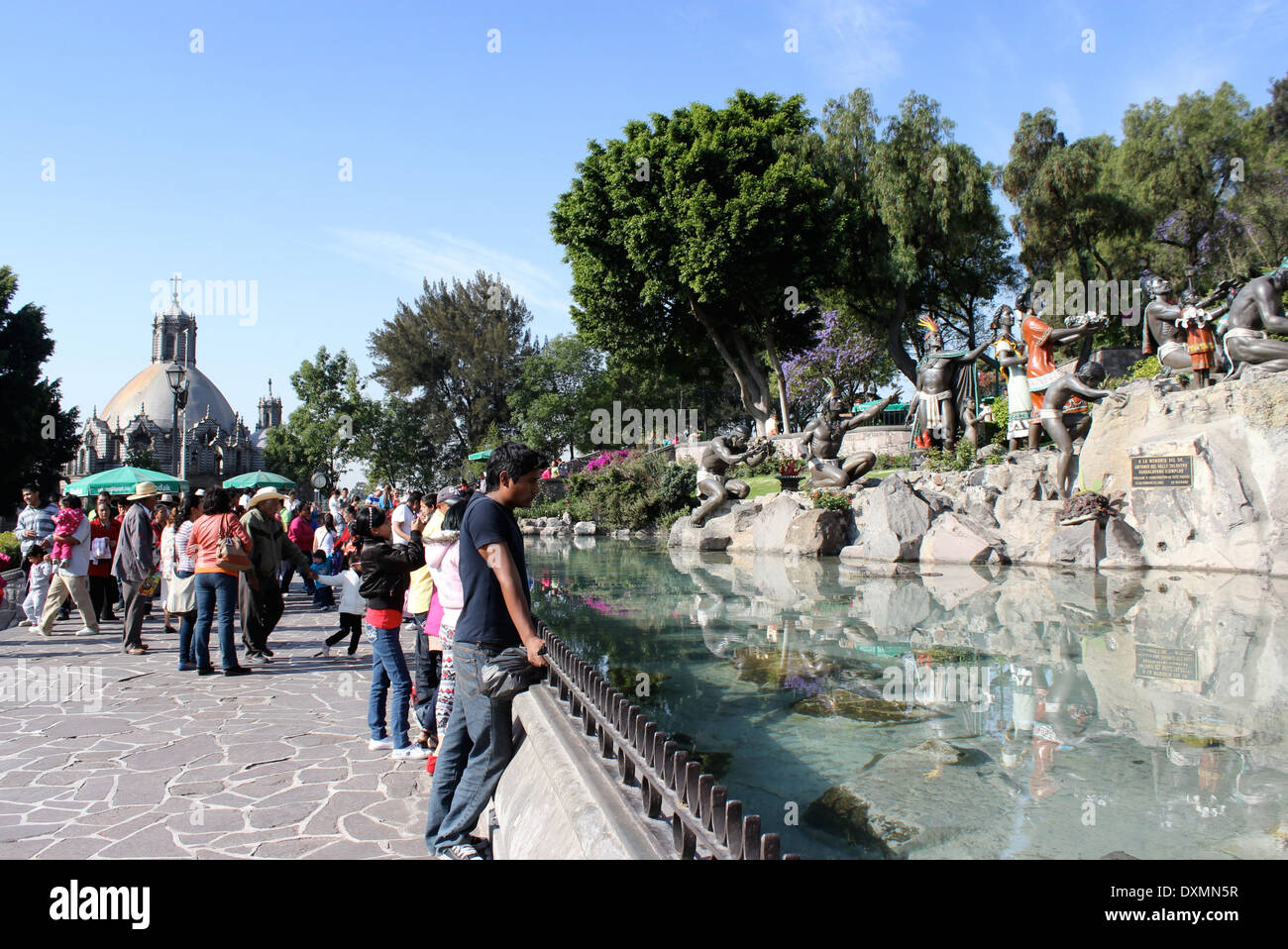 People by the pond and statues on Tepeyac Hill, Basilica de Guadalupe ...