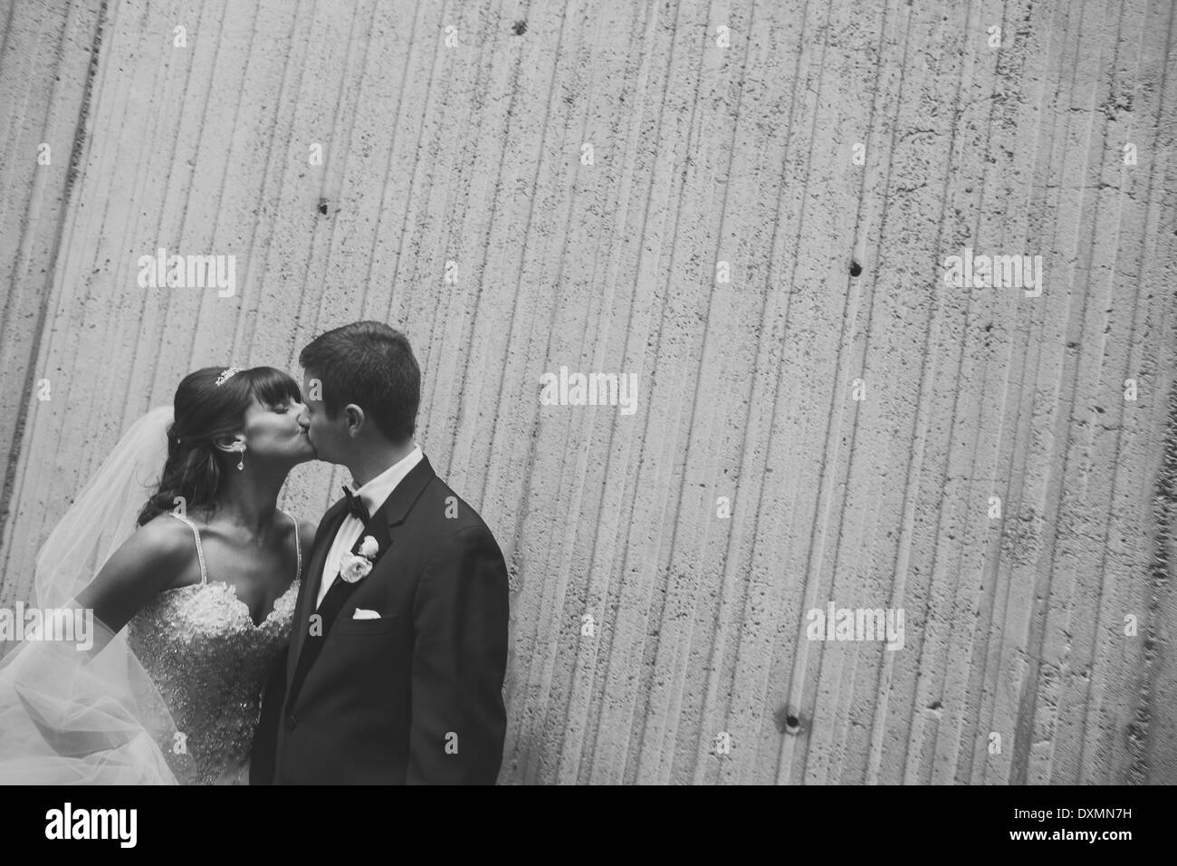 Bride and Groom Kissing Stock Photo - Alamy