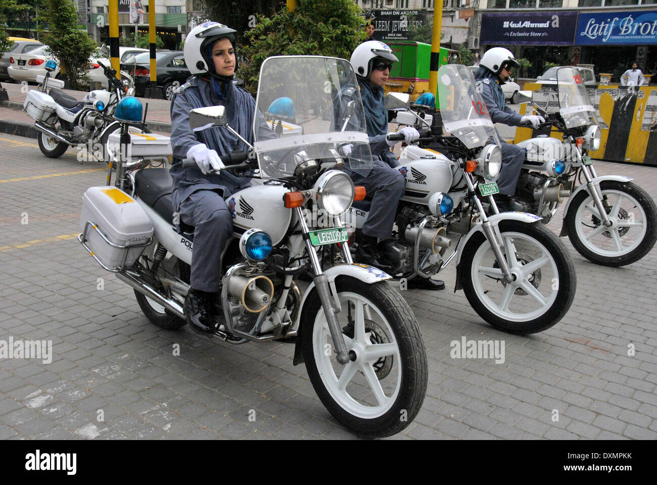 Lahore. 27th Mar, 2014. Pakistani female traffic police wardens patrol ...