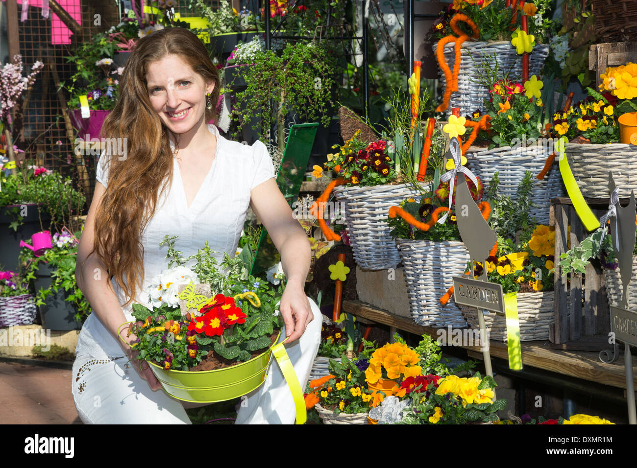 Customer at flower shop posing with floral arrangement Stock Photo - Alamy