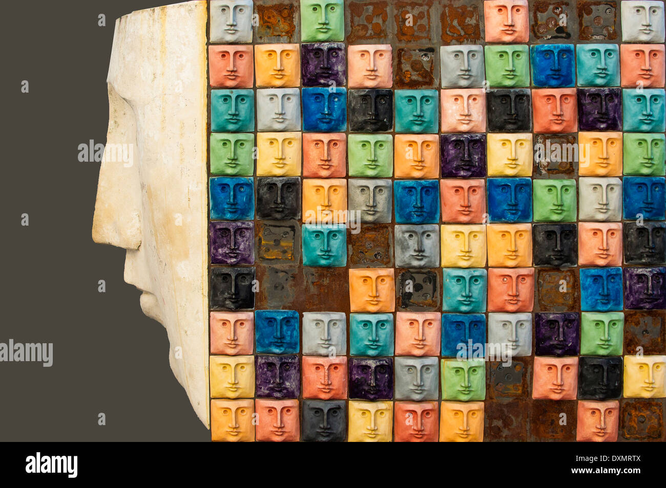 Statue made of tiles representing faces hi-res stock photography and ...