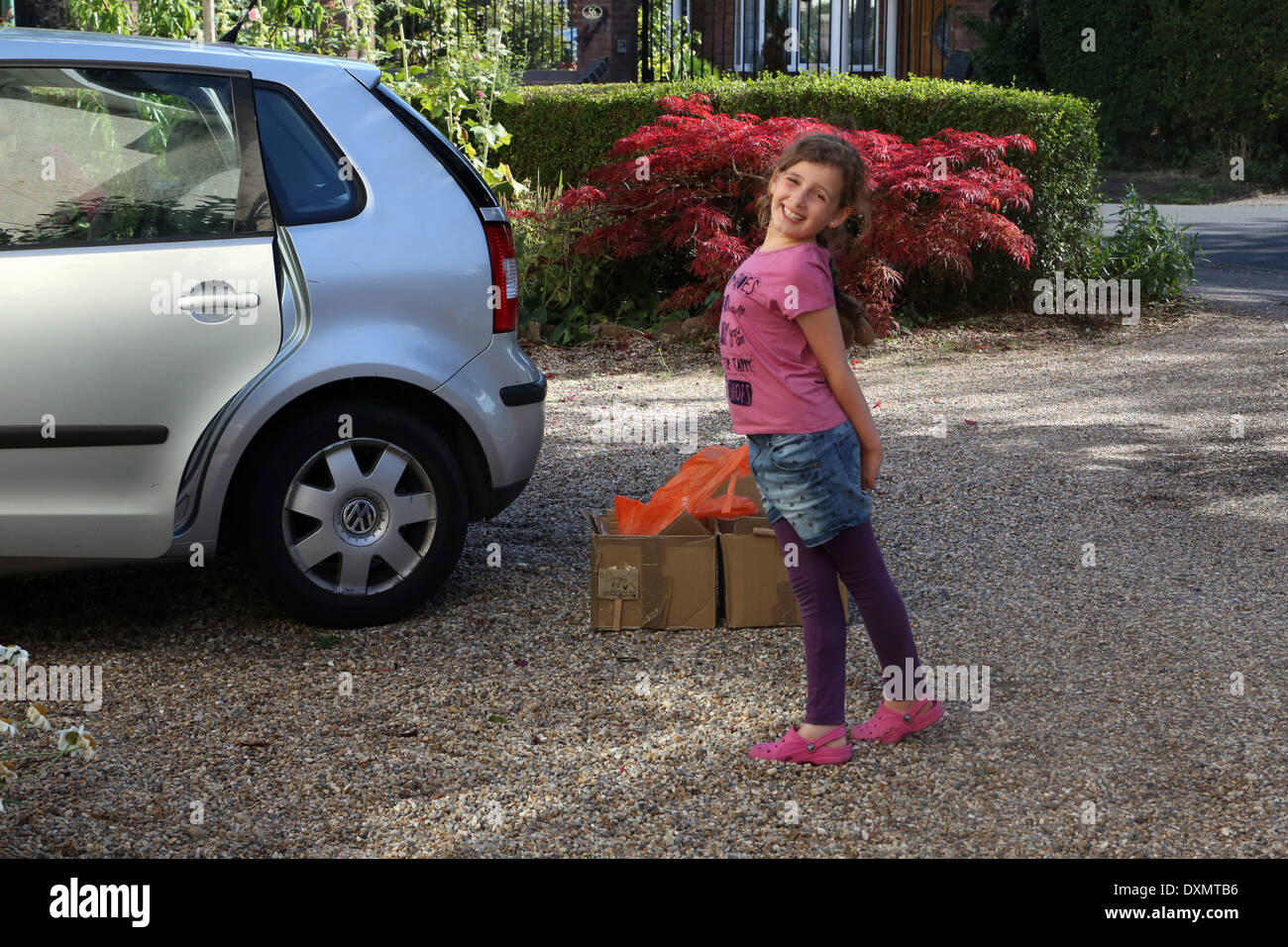 Girl Smiling Standing in Drive By Car Ready To Leave Surrey England ...
