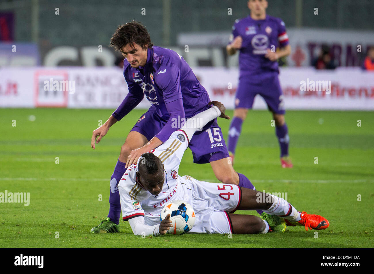 Firenze, Italy. 26th Mar, 2014. Mario Balotelli (Milan), Stefan Savic ...