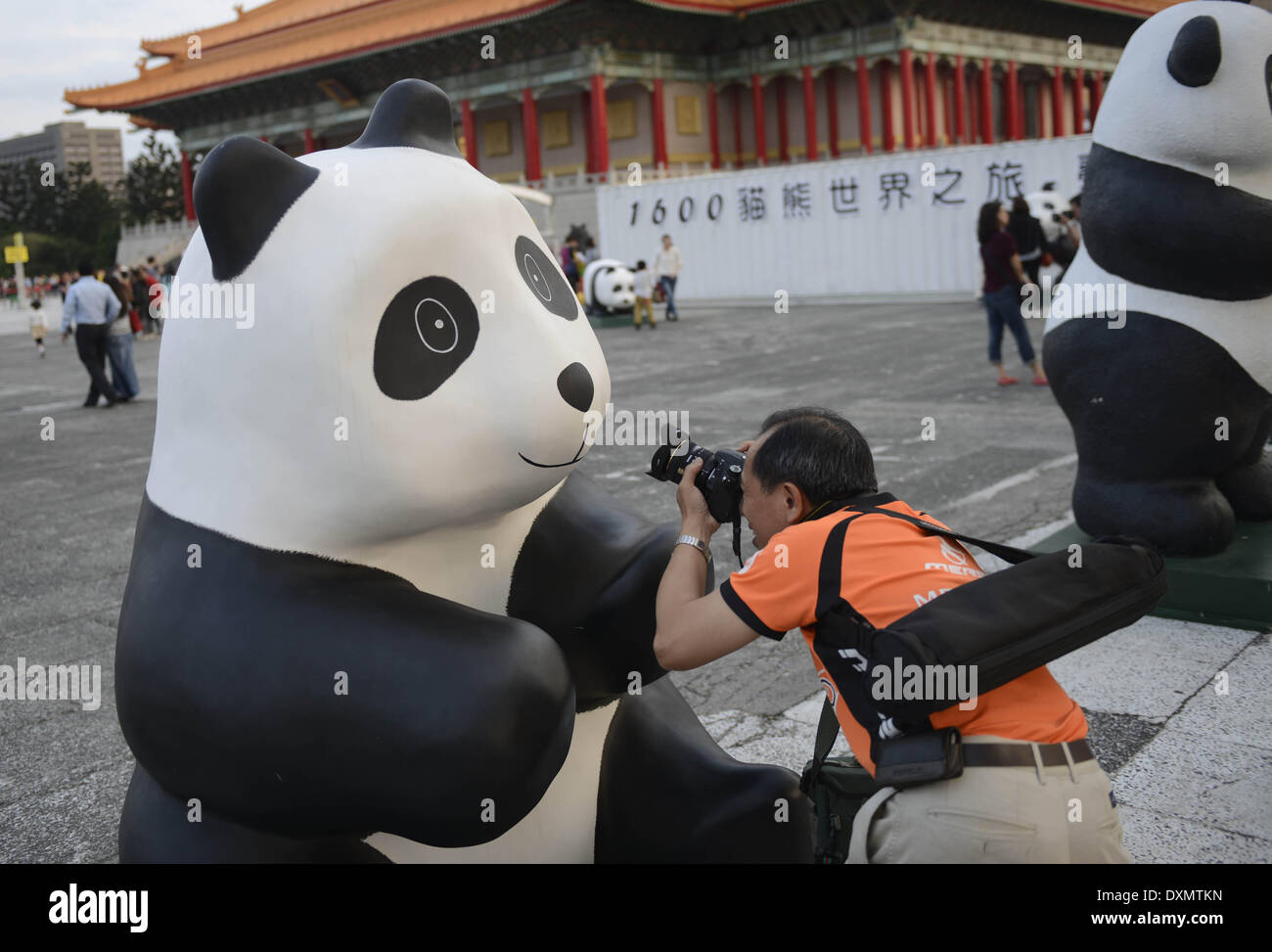 Taipei, China's Taiwan. 27th Mar, 2014. A tourist takes photos of a ...