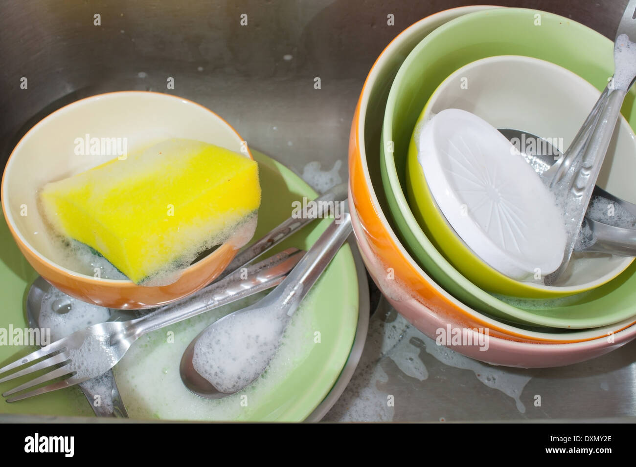 sink and dishes after dinner are waiting to watch Stock Photo - Alamy