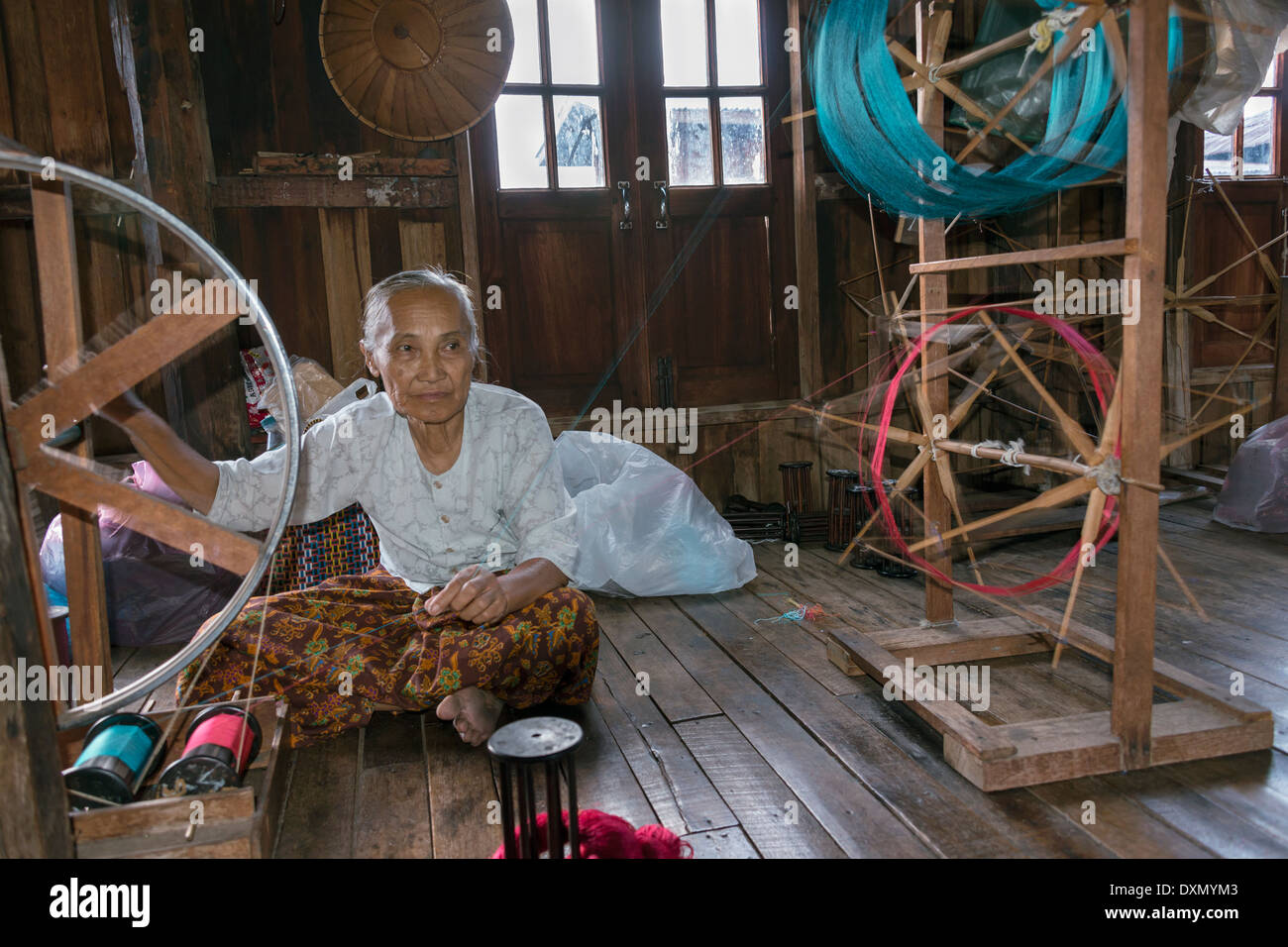 Woman winding silk thread onto bobbins hi-res stock photography and ...