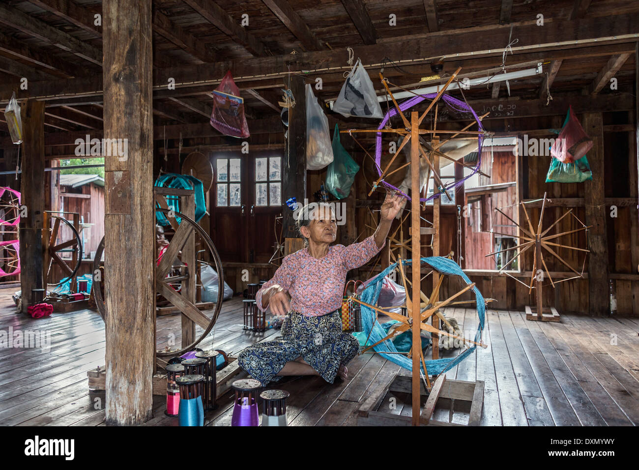 Woman winding silk thread onto bobbins hi-res stock photography and ...