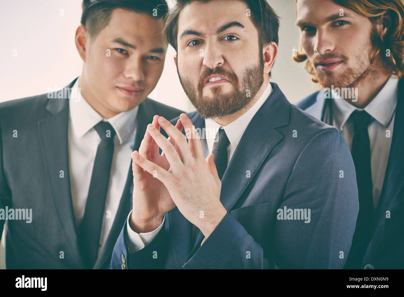 Bearded businessman with evil expression Stock Photo - Alamy