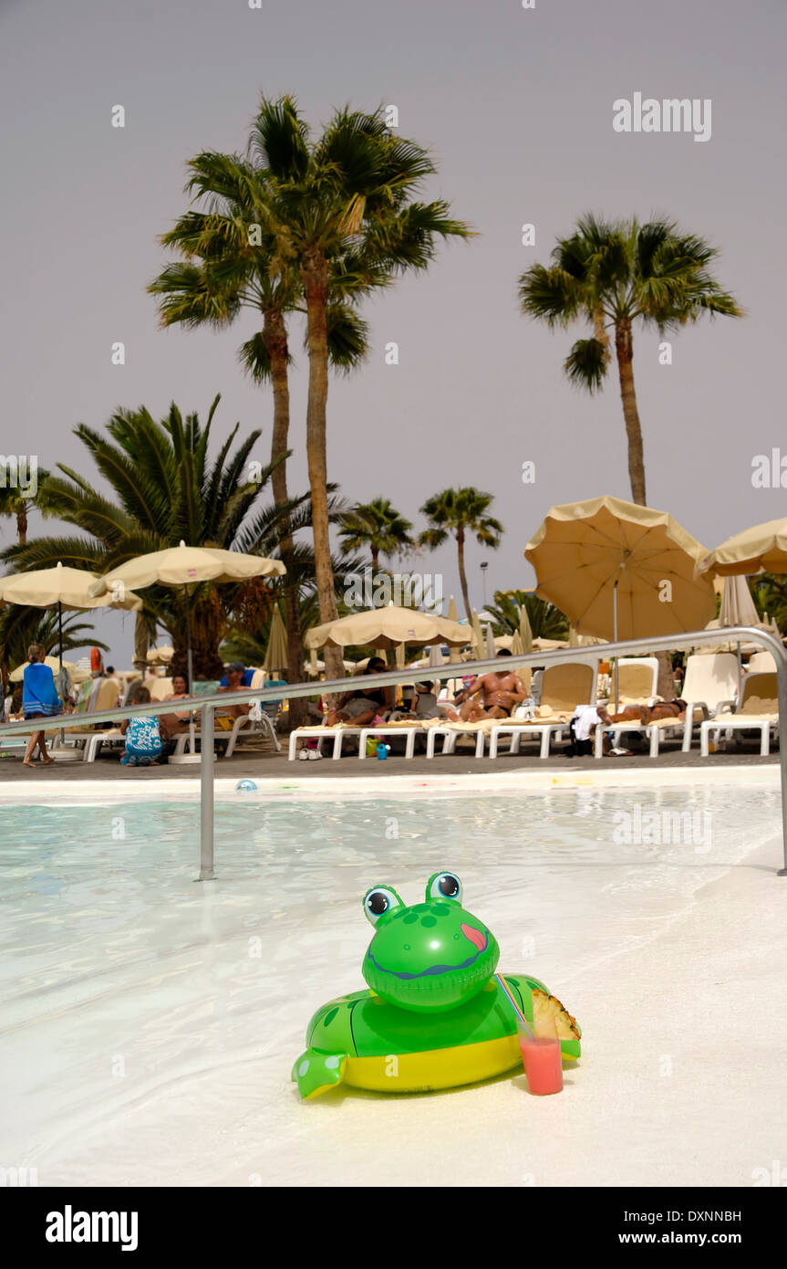 Happy frog is enjoying a cool drink by the pool Stock Photo - Alamy