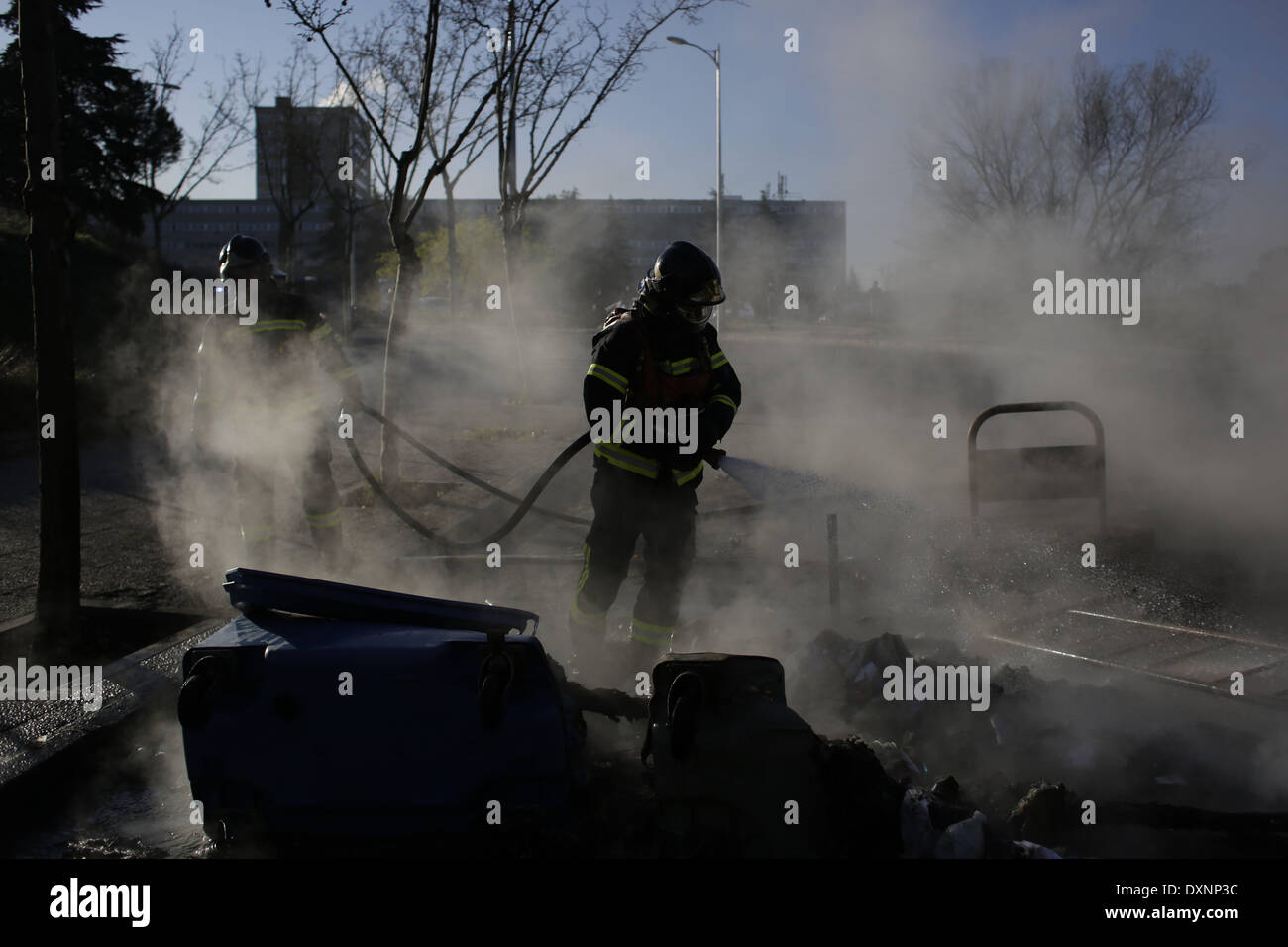 Madrid, Spain. 27th Mar, 2014. Firefighters extinguish the fire of a ...