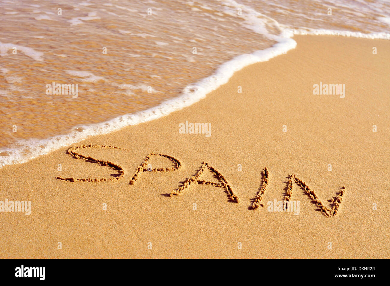 spain written in the sand of a beach Stock Photo - Alamy
