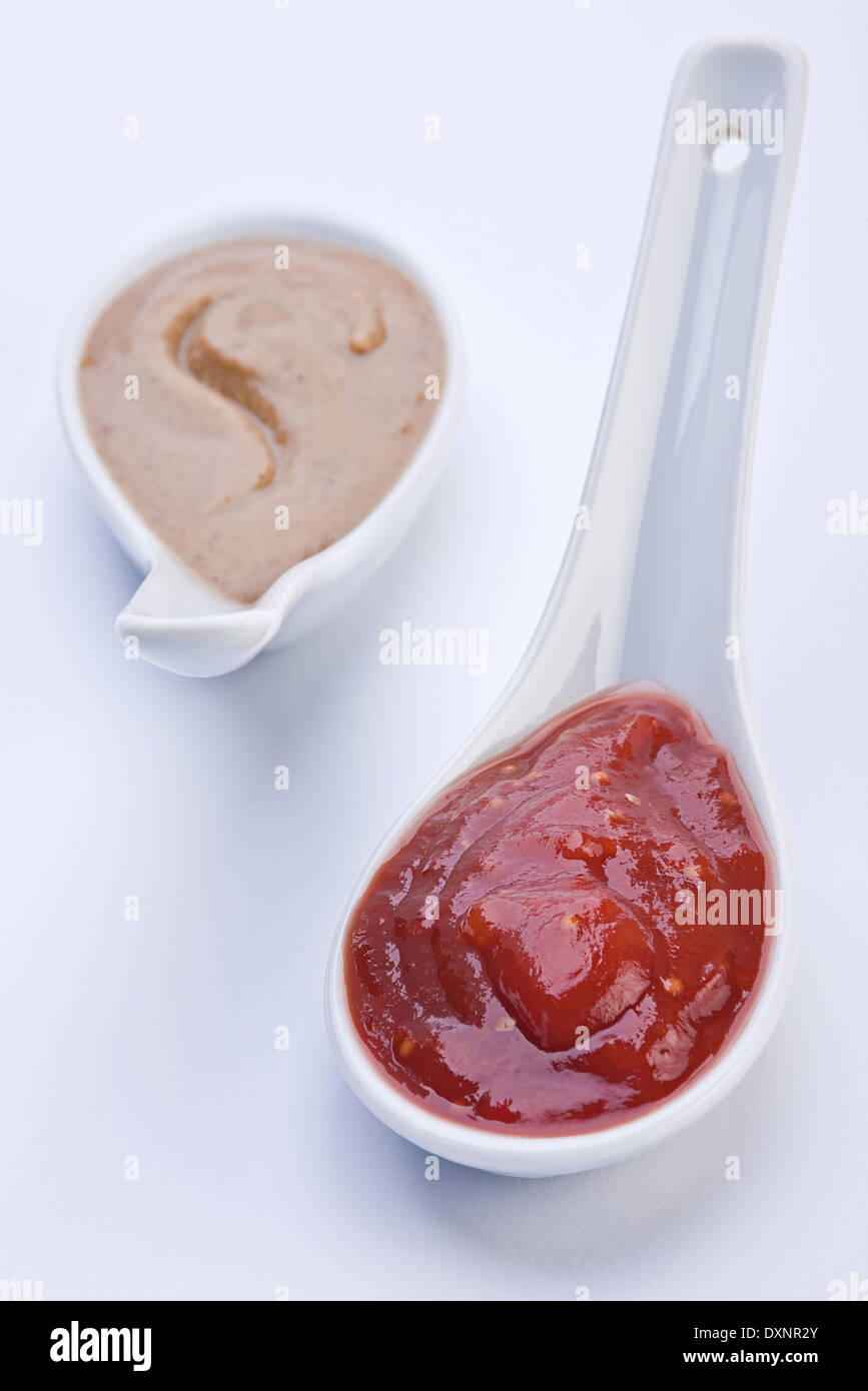 Ketchup in white ceramic spoon Stock Photo - Alamy