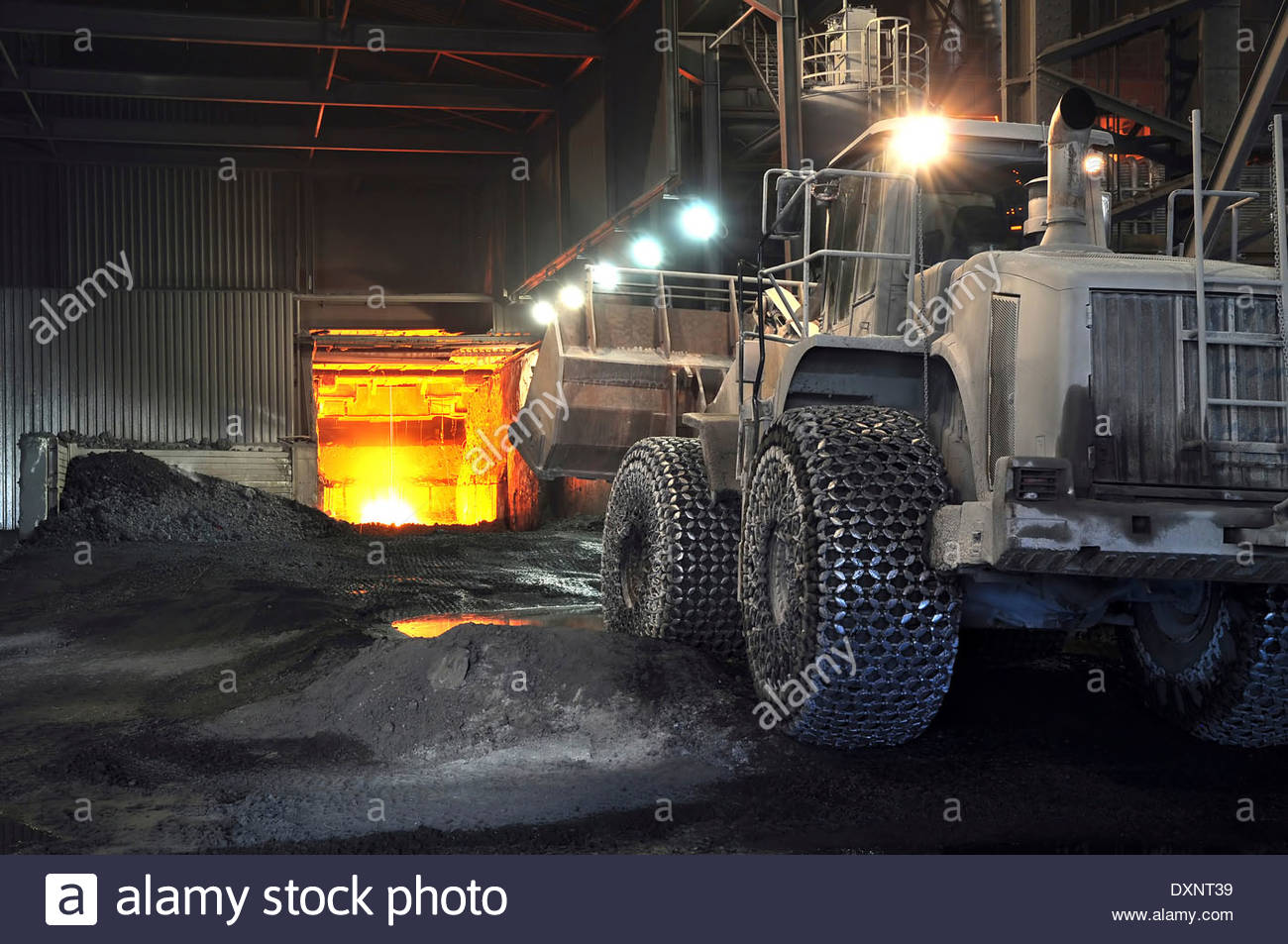 Germany, Steel mill, removal of slag with shovel excavator Stock Photo ...