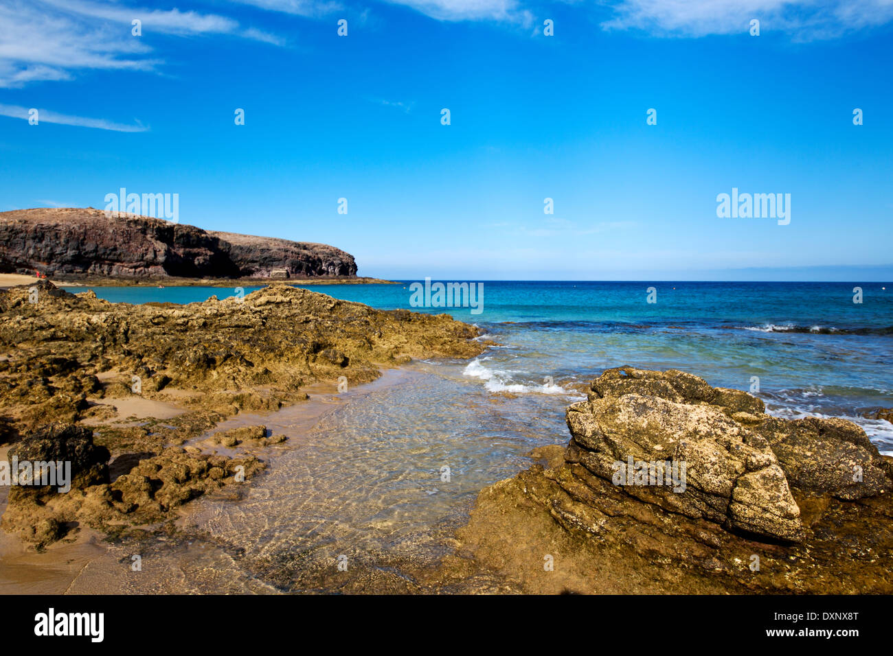 in lanzarote spain rock stone sky cloud beach water musk pond coastline ...
