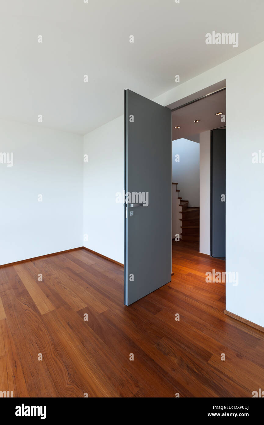 Modern apartment, empty room with door open Stock Photo - Alamy