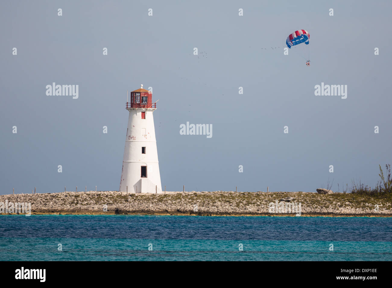 A parasail passes Paradise Island Lighthouse, Nassau, Bahamas ...