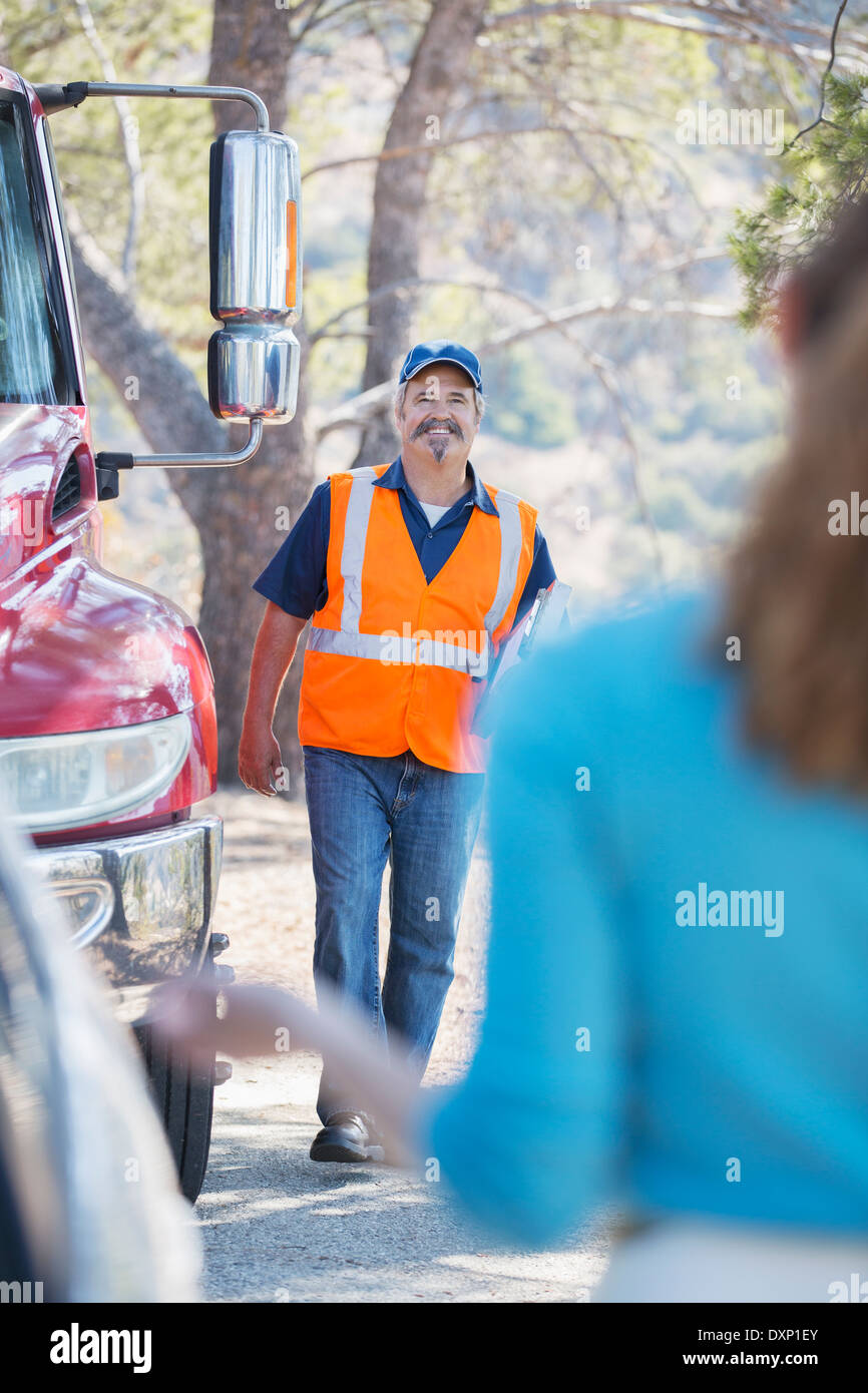 Roadside mechanic arriving to help woman Stock Photo - Alamy