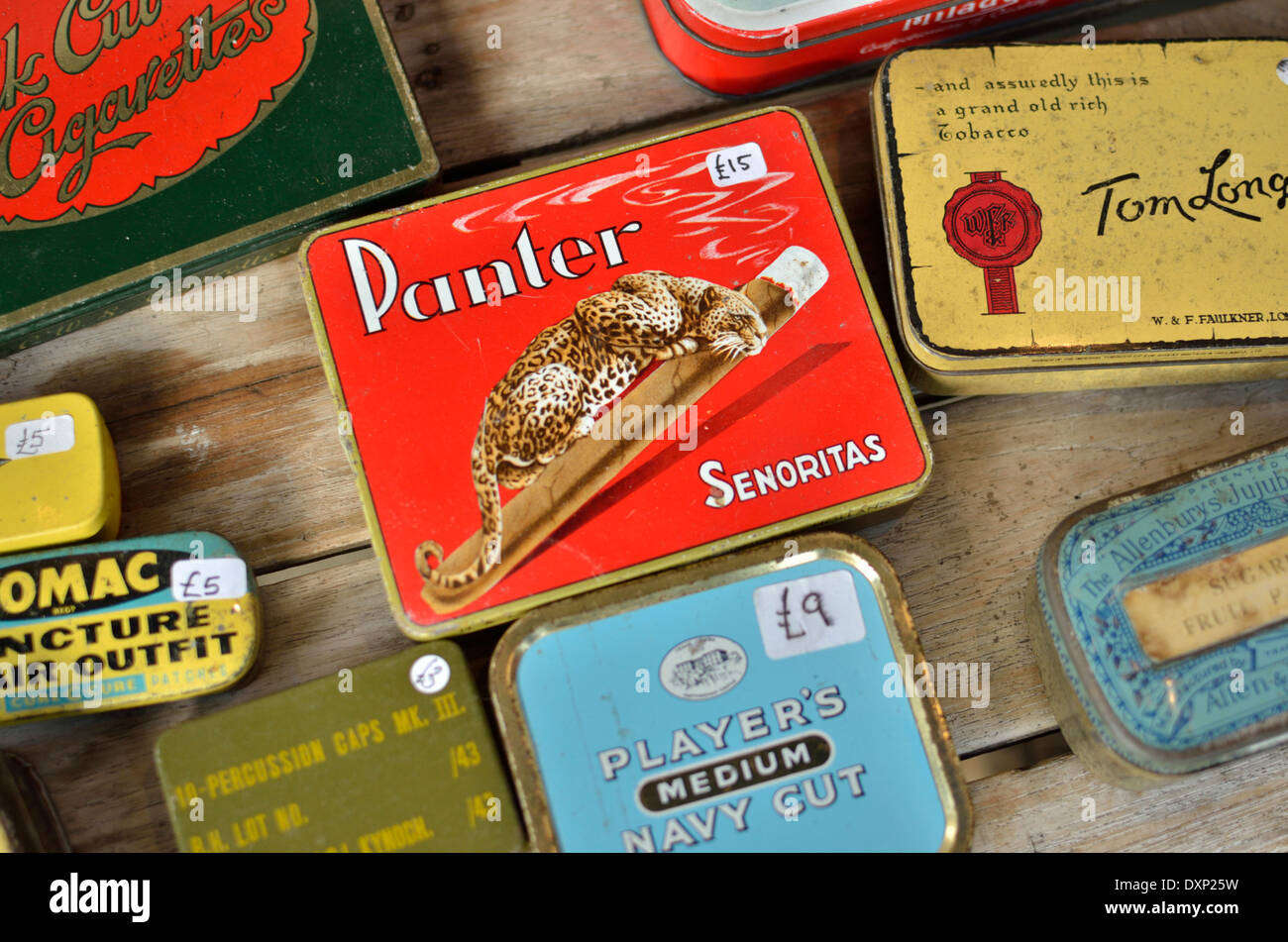 Colourful old tin boxes on a market stall, Portobello Road, Notting ...
