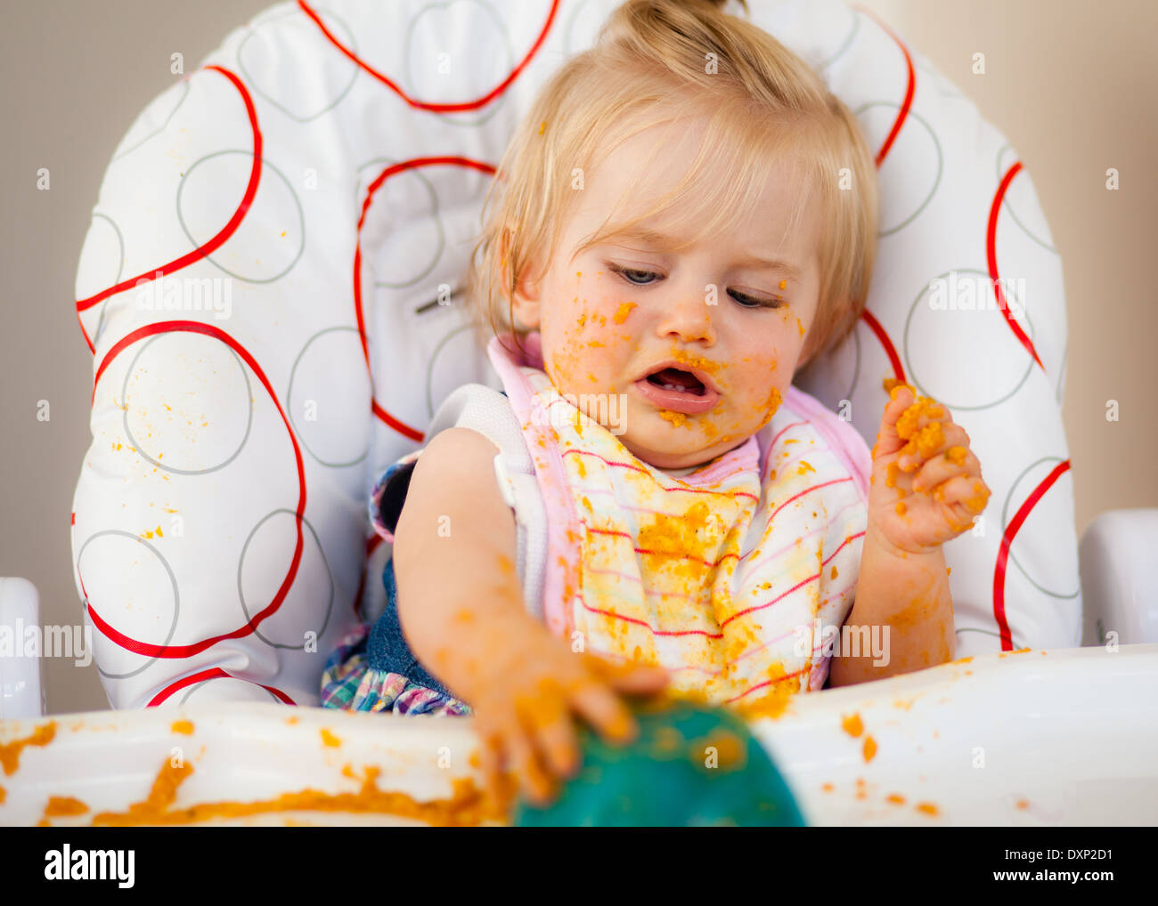 Little baby making a mess with food Stock Photo - Alamy