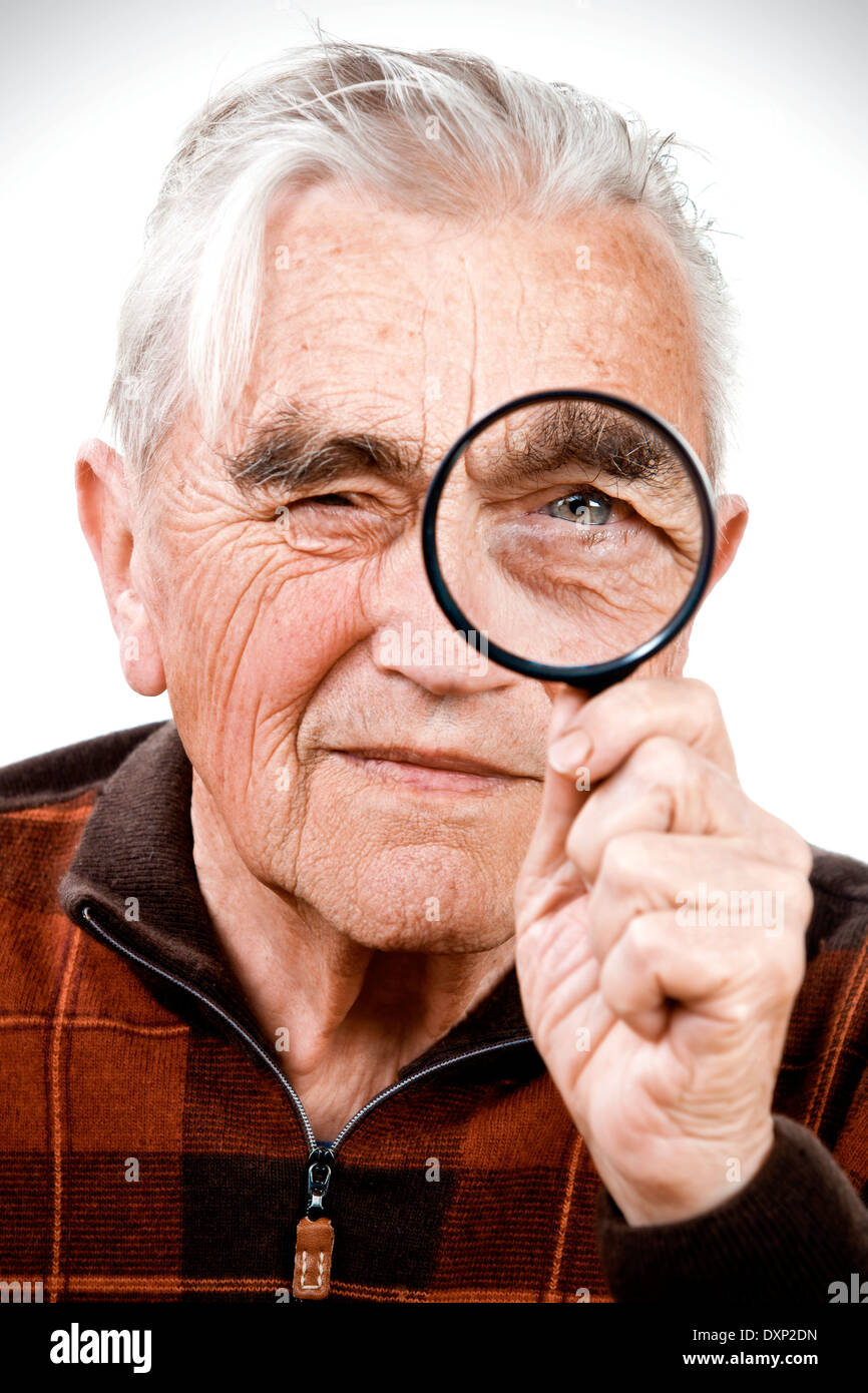 Old man magnifying glass eye hi-res stock photography and images - Alamy
