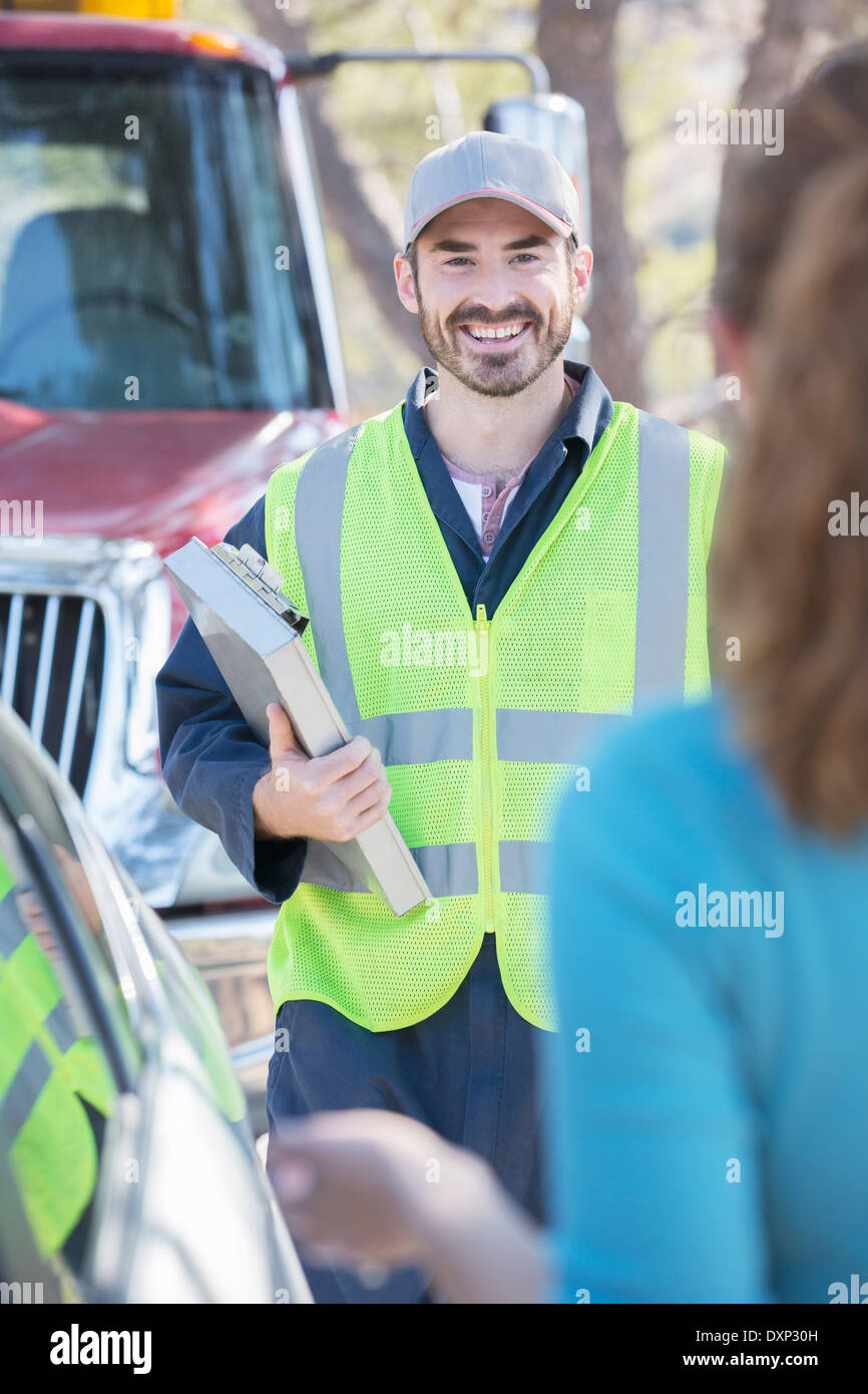 Roadside mechanic arriving to help woman Stock Photo - Alamy