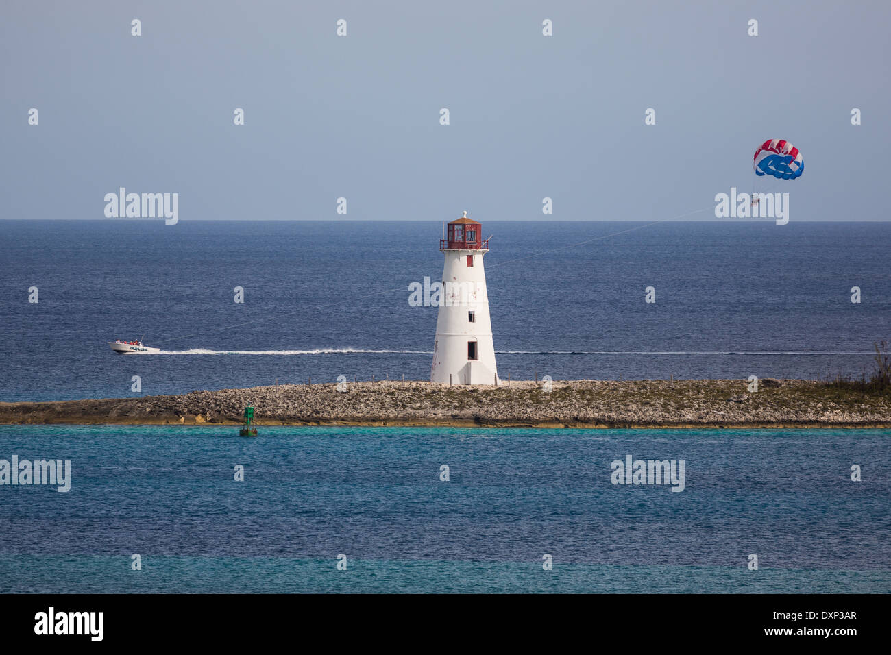 A parasail passes Paradise Island Lighthouse, Nassau, Bahamas ...