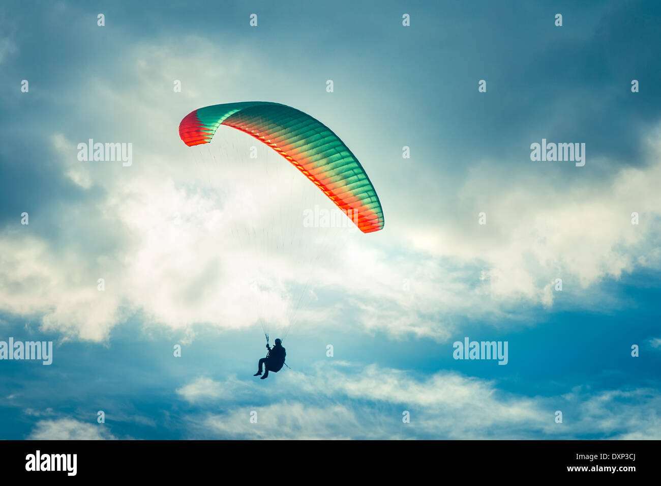 Paragliding extreme Sport with blue Sky and clouds on background ...