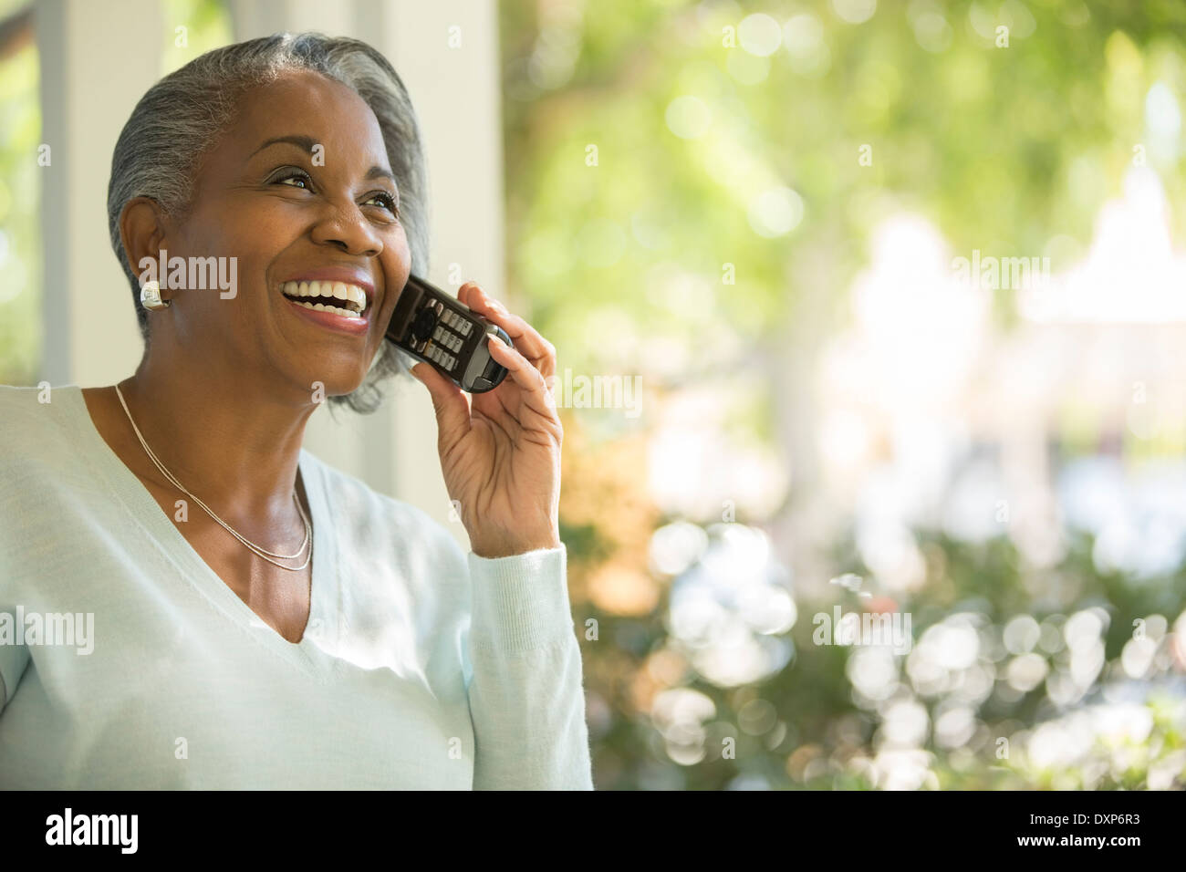 Elderly woman talking on the telephone hi-res stock photography and ...