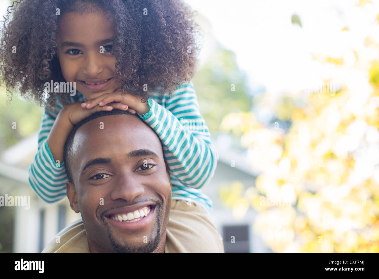 Father carrying young daughter on shoulder hi-res stock photography and images - Alamy