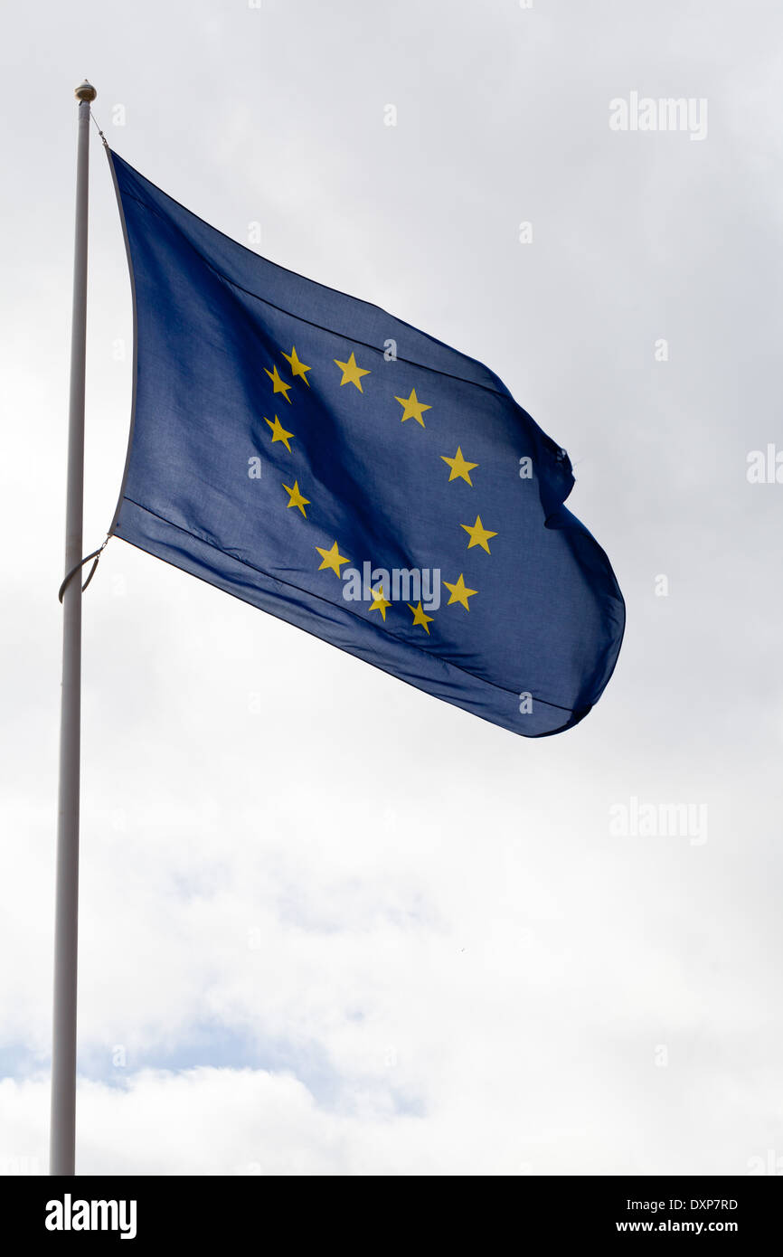 European flag waving in the wind with storm clouds Stock Photo - Alamy