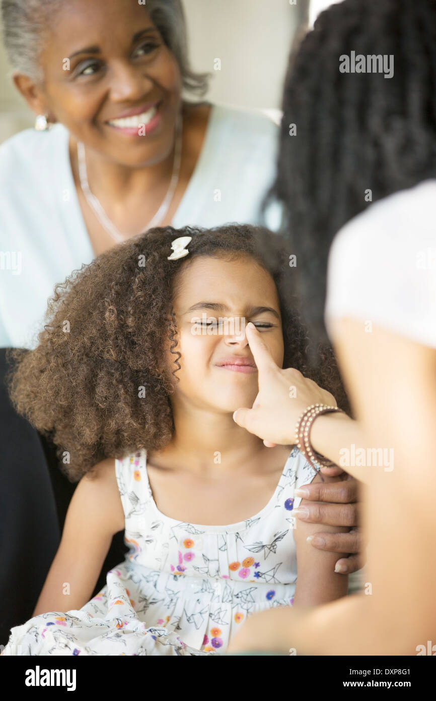 Woman touching nose hi-res stock photography and images - Alamy