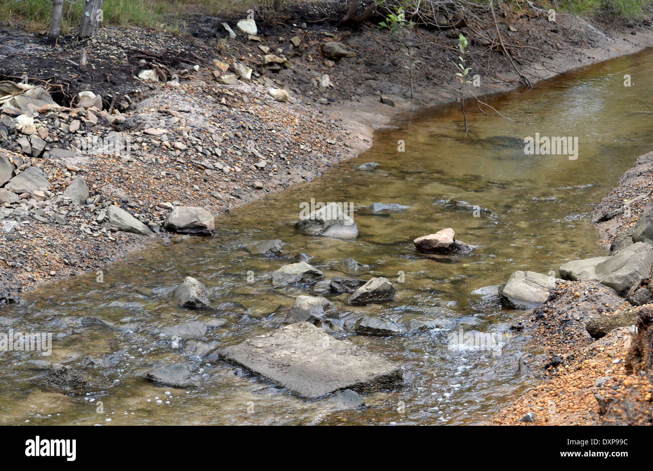 polluted rocky creek Stock Photo - Alamy