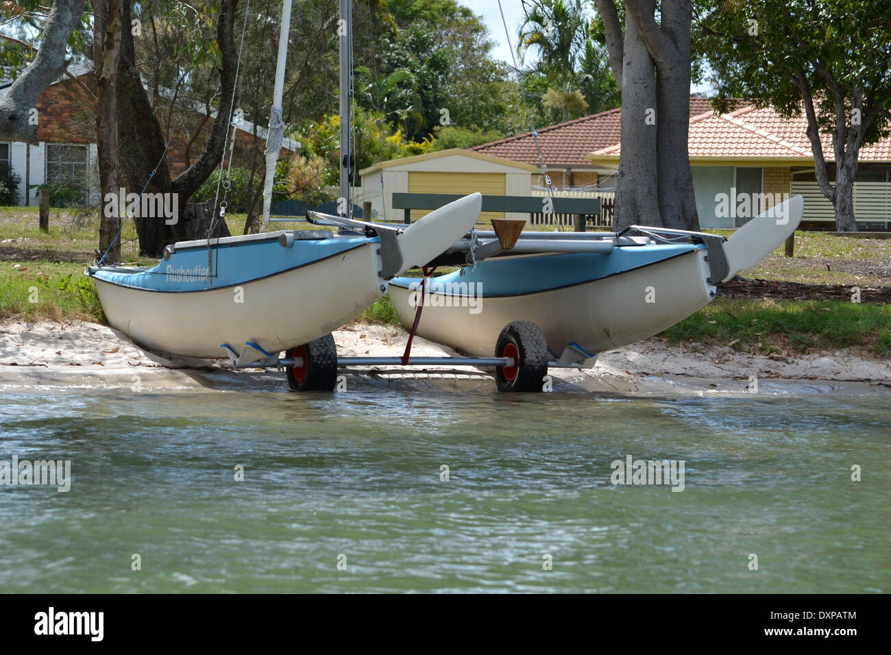 small sailing catamaran ready to launch into water Stock Photo - Alamy