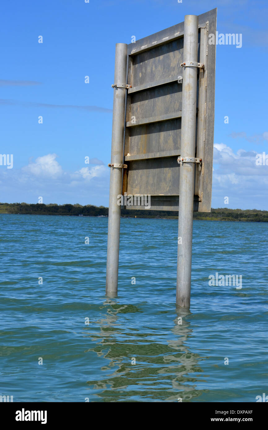 Caution submerged outlet located 20m. Front of this sign Stock Photo ...