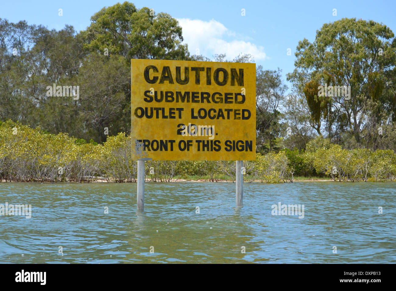 Caution submerged outlet located 20m. Front of this sign Stock Photo ...