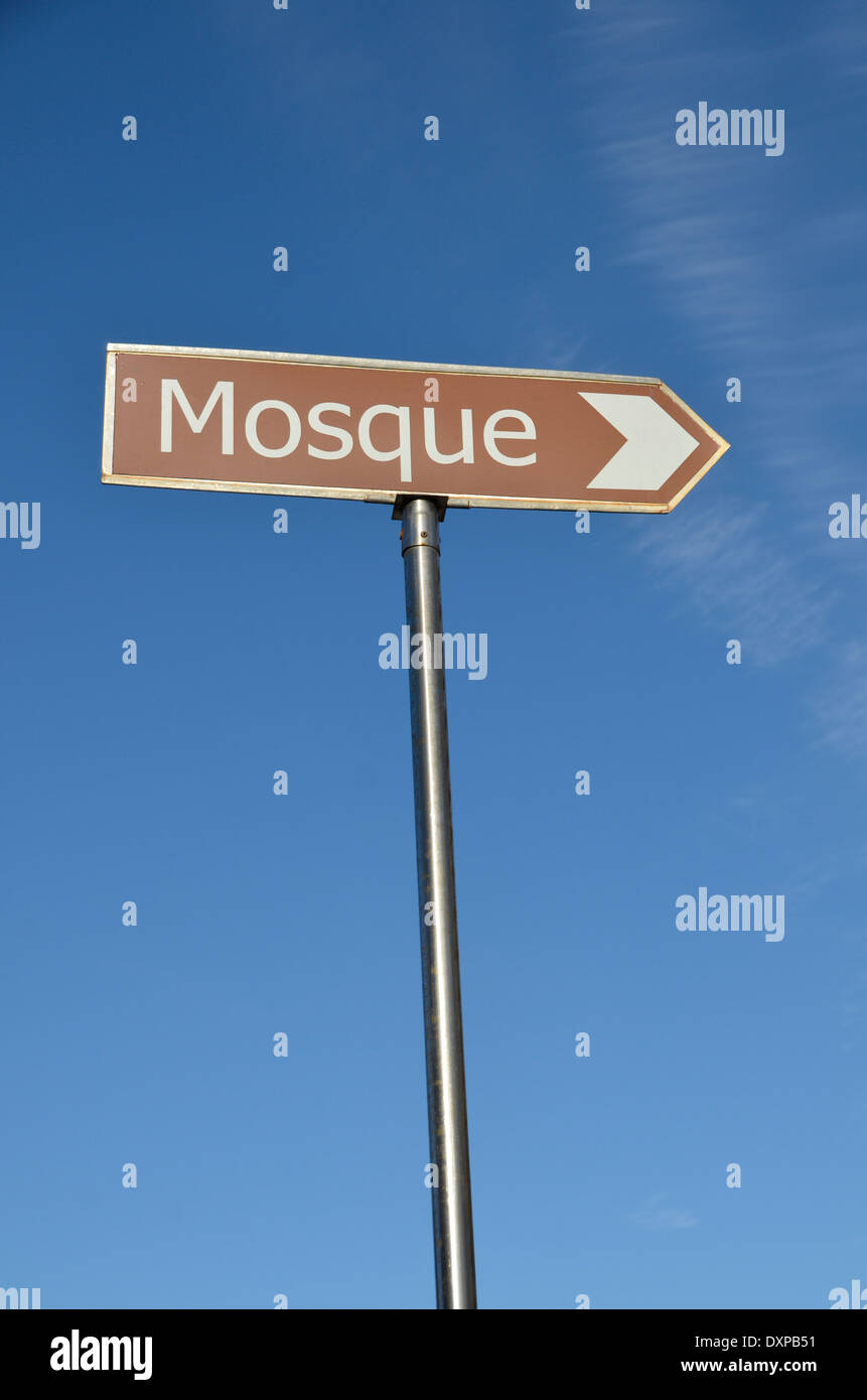 Mosque direction sign against a blue sky Stock Photo - Alamy