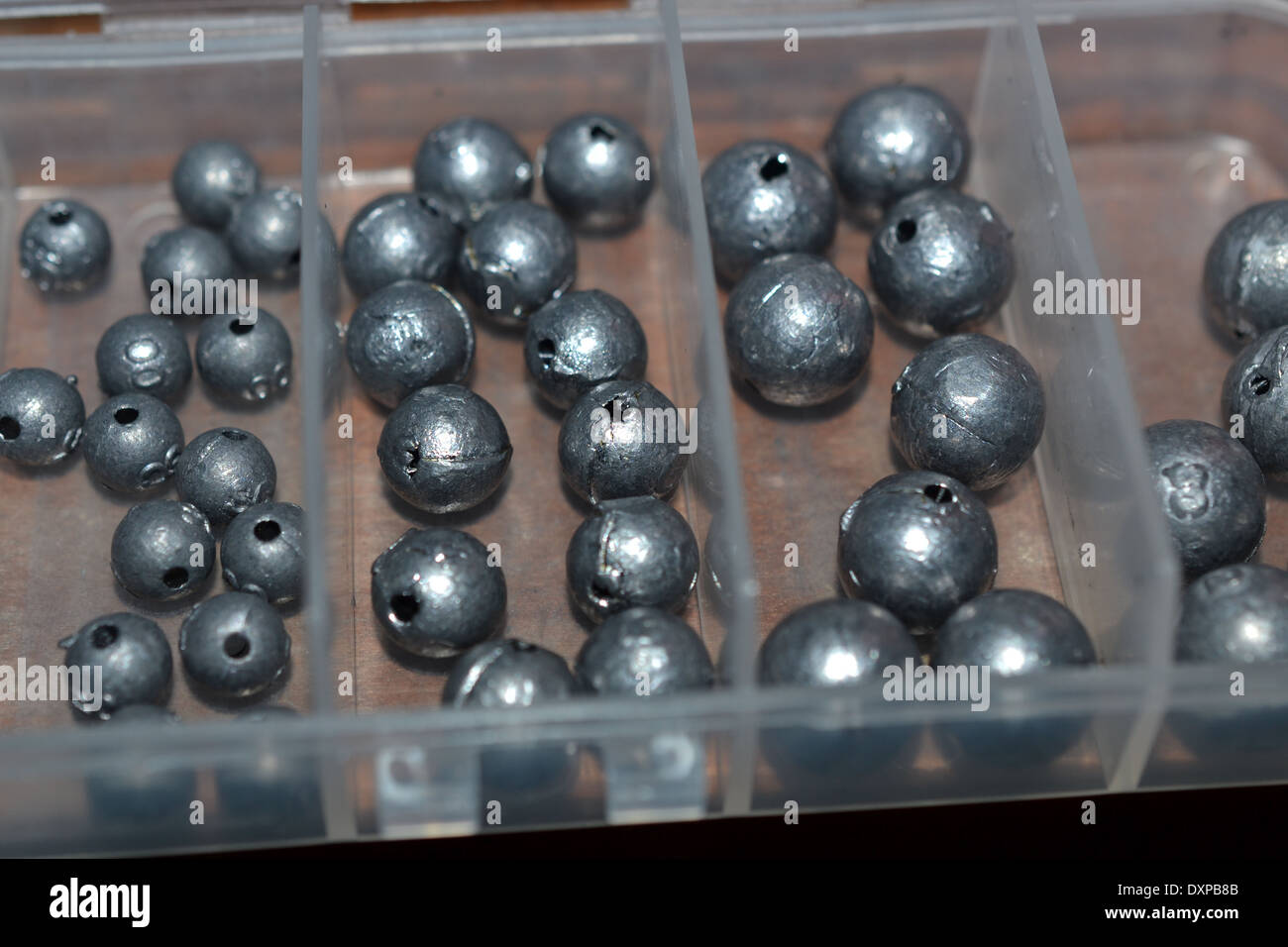 Small tackle box with different sized lead sinkers Stock Photo - Alamy