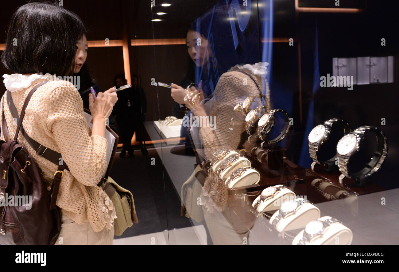 Basel, Switzerland. 28th Mar, 2014. People look at watches of the Swiss ...