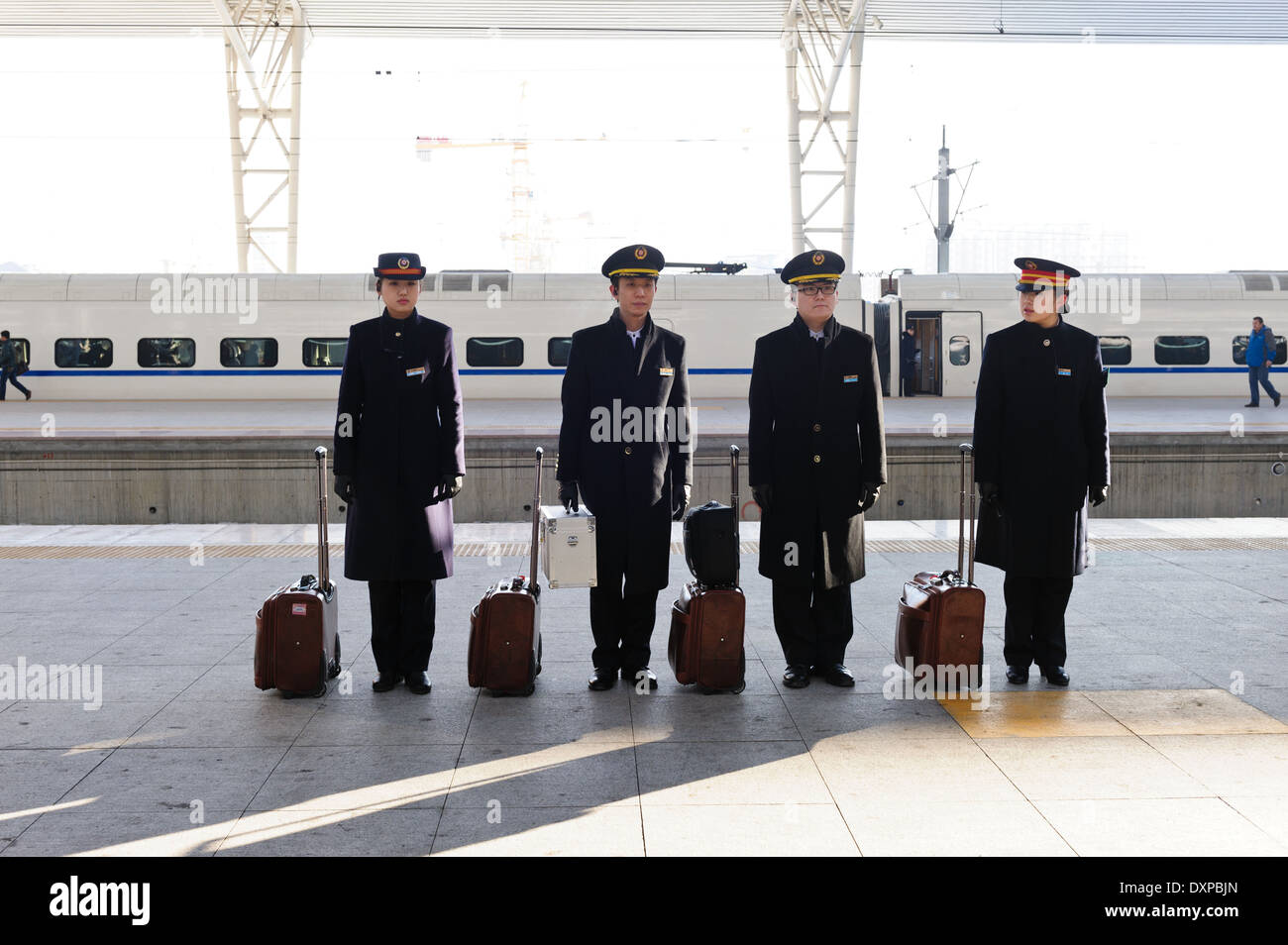 Crew of high speed train at train station of Jilin town waiting to ...