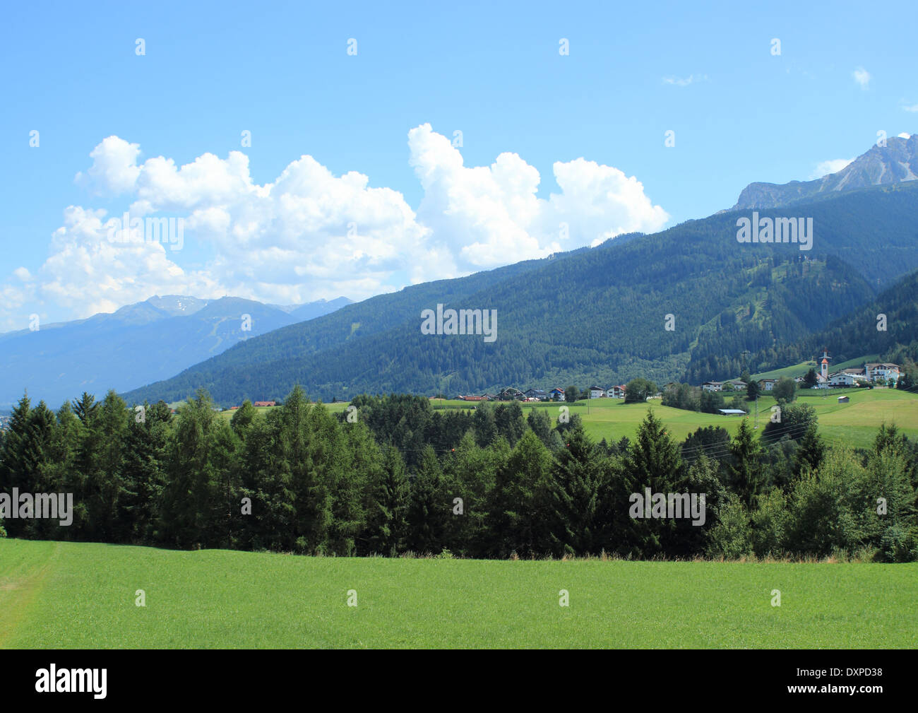 Typical view over the Alps with small village Stock Photo - Alamy
