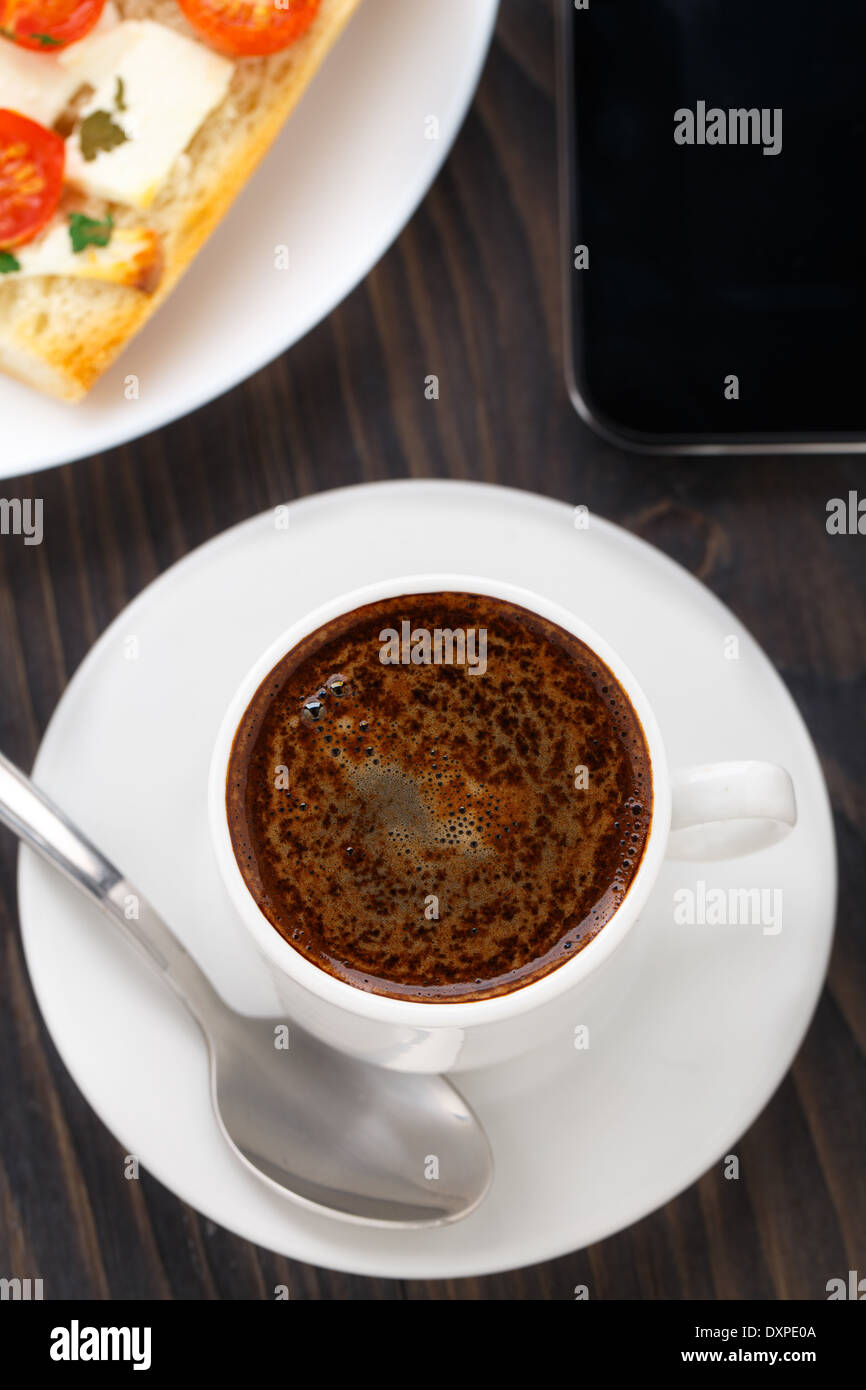 Cup of coffee, sandwich and tablet Stock Photo - Alamy