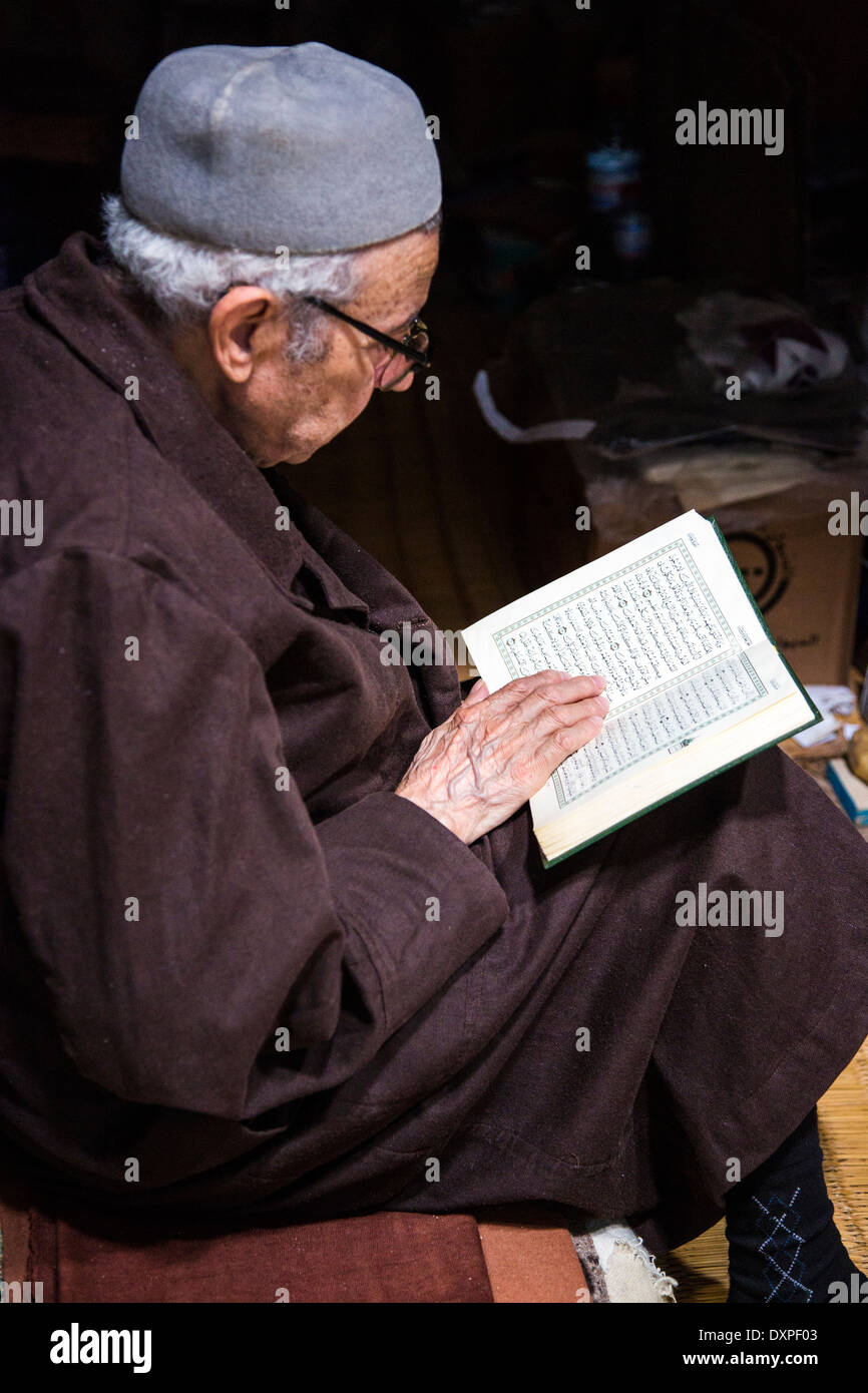 Muslim Man Reading Quran High Resolution Stock Photography and Images ...