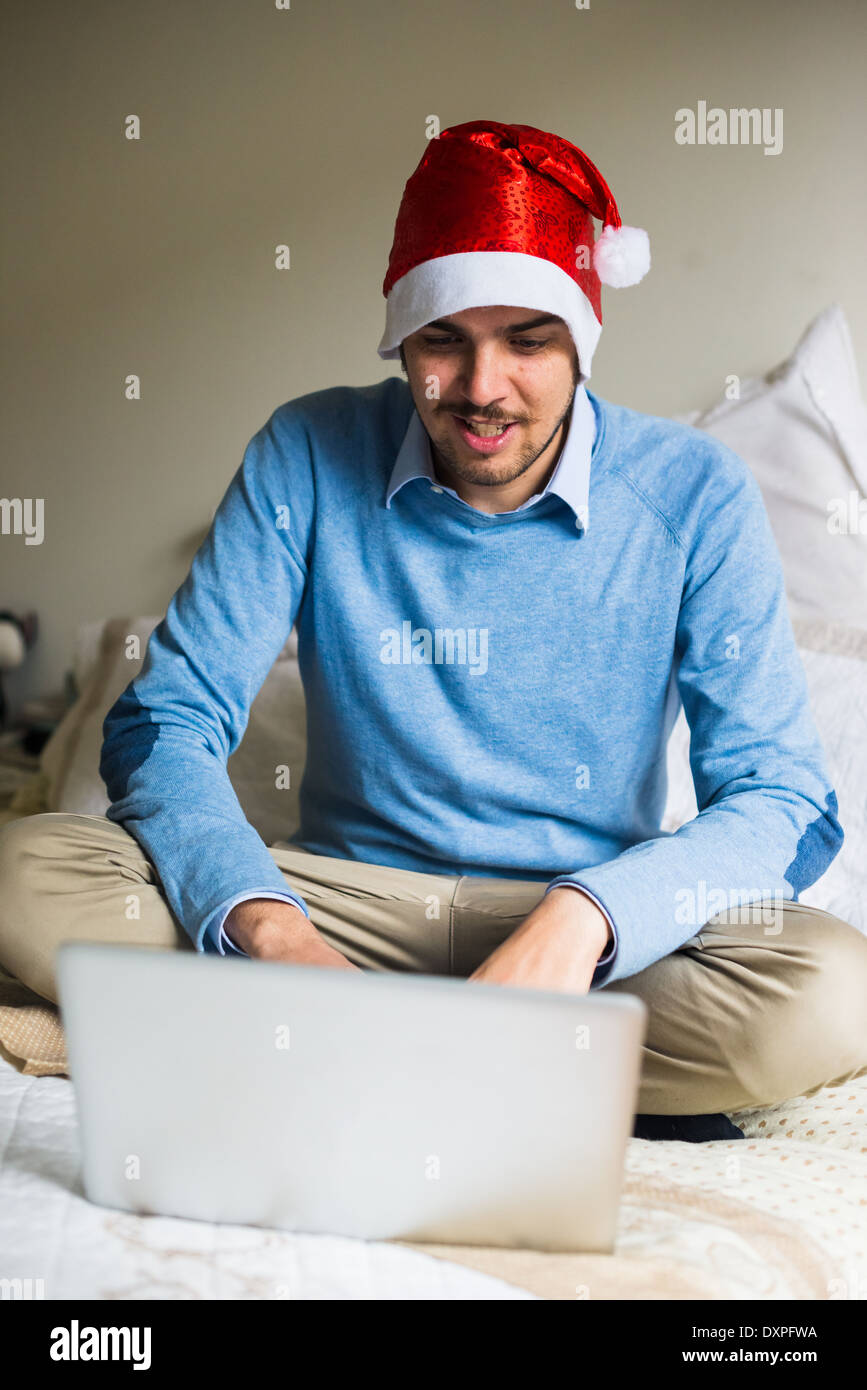elegant business multitasking christmas man using devices at home Stock ...