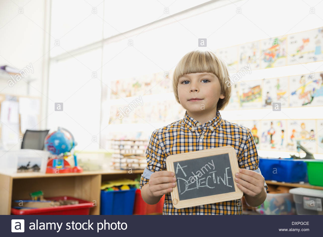 Boy holding slate with hi-res stock photography and images - Alamy