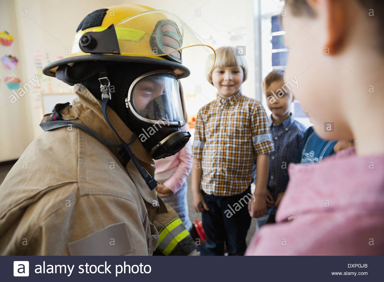 Firefighter giving presentation to elemetary children Stock Photo - Alamy
