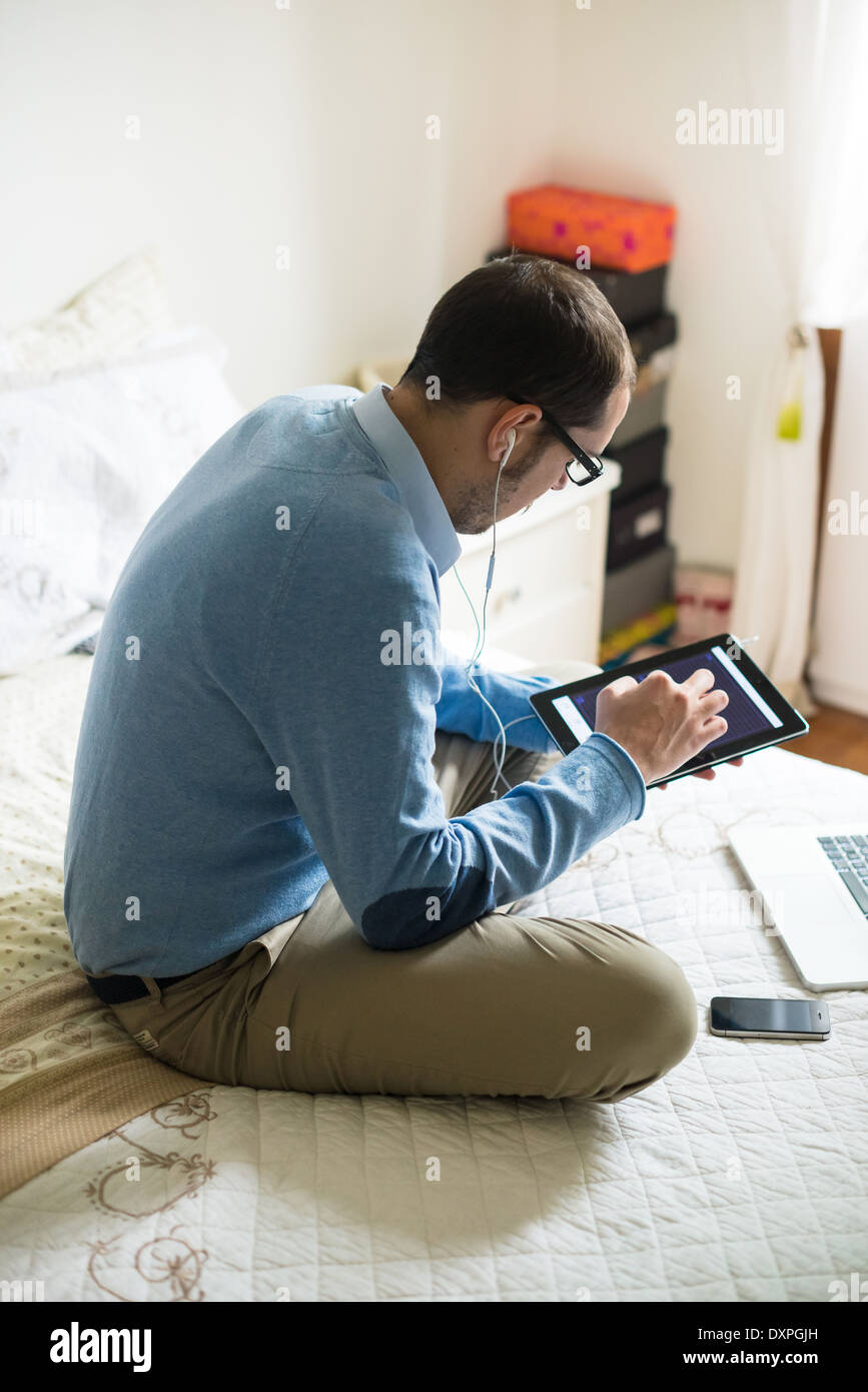 elegant business multitasking multimedia man using devices at home ...