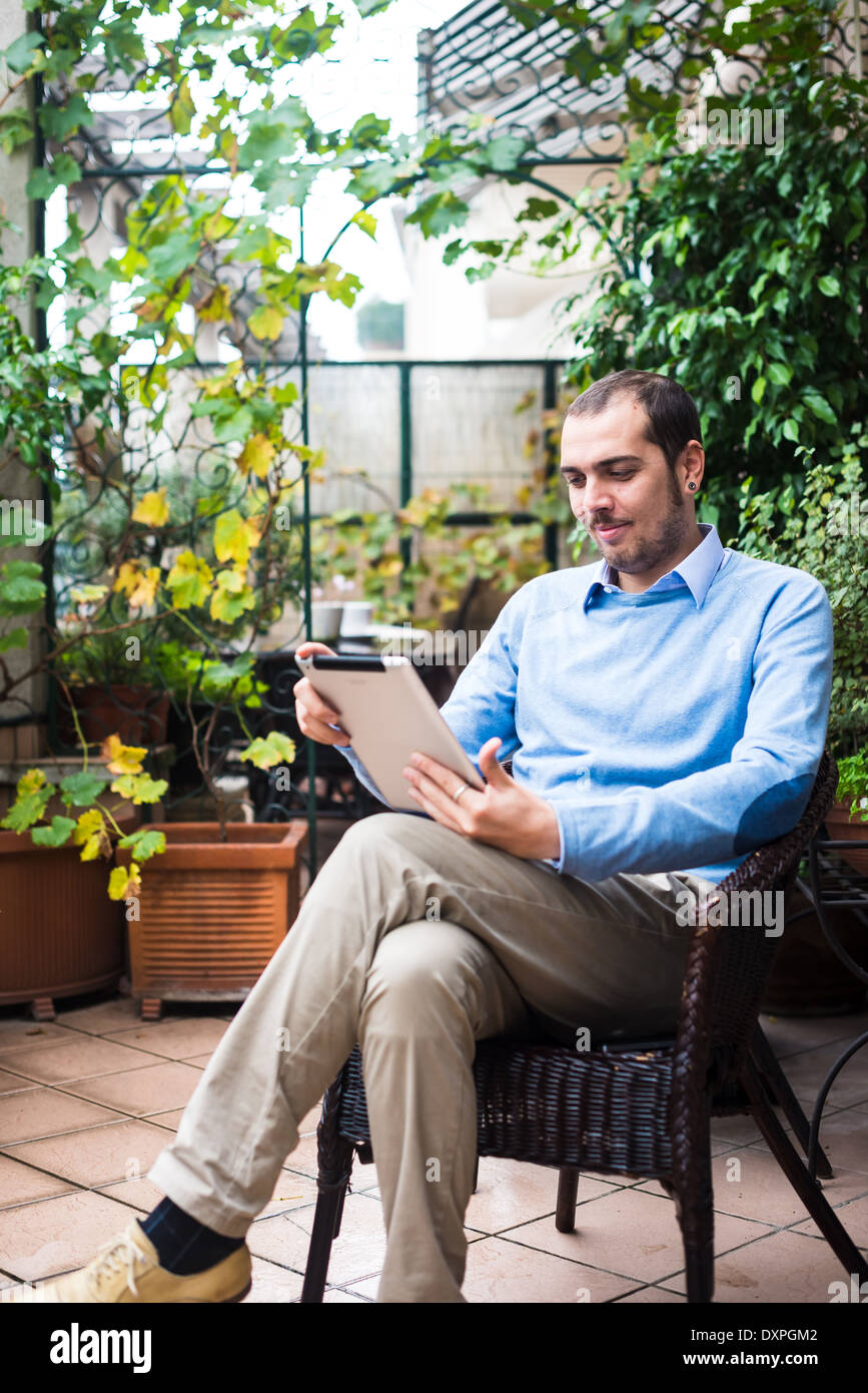 elegant business multitasking multimedia man using devices at home ...