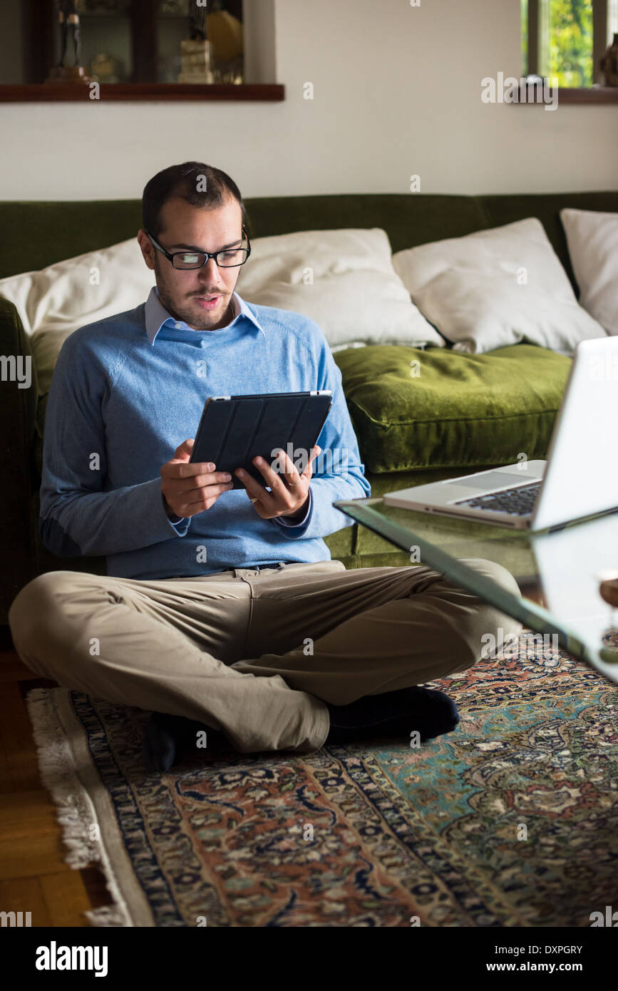 elegant business multitasking multimedia man using devices at home ...